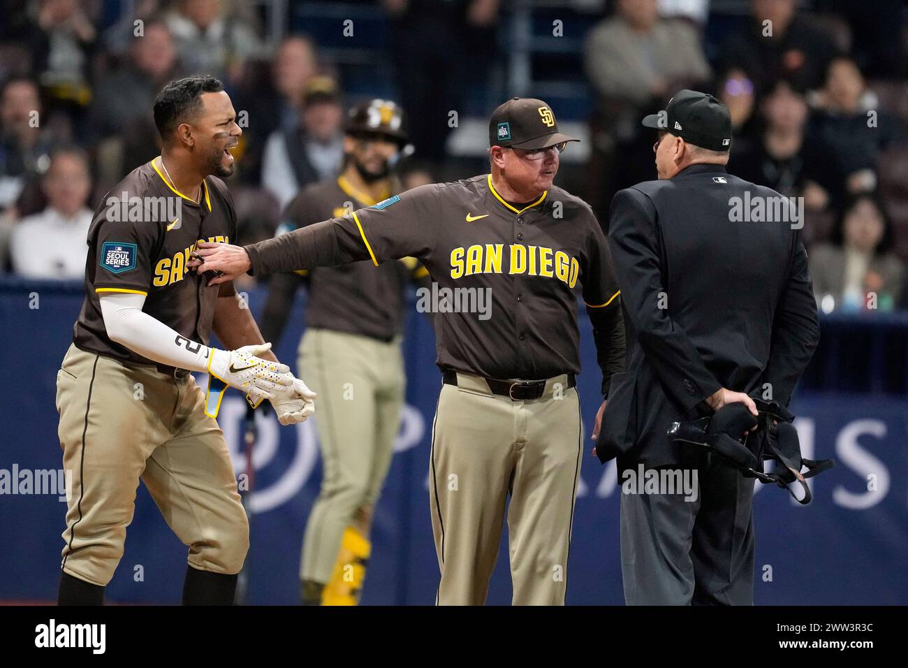 San Diego Padres' Xander Bogaerts, left, argues with home plate umpire ...