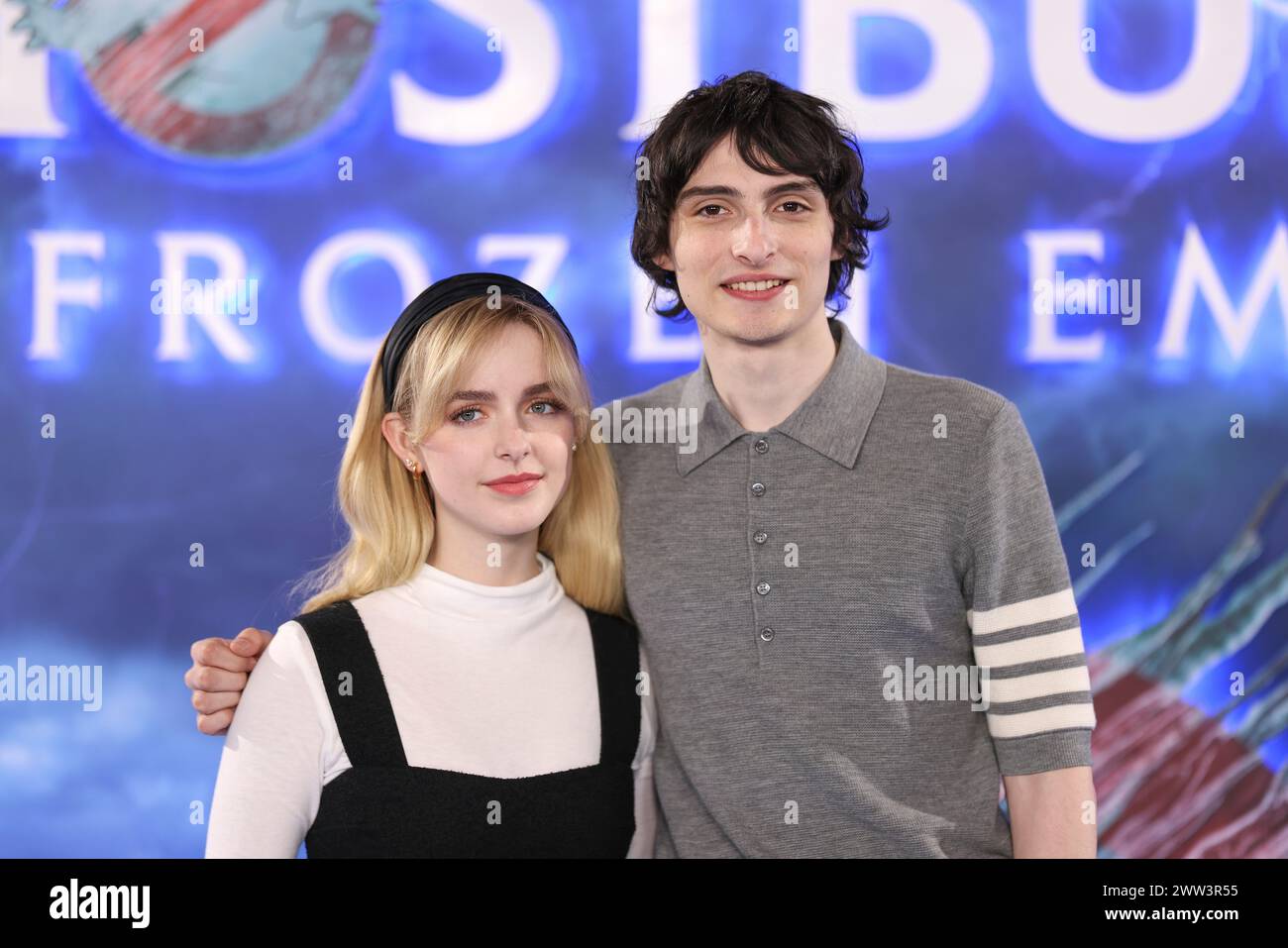 McKenna Grace, left, and Finn Wolfhard pose for photographers at the ...