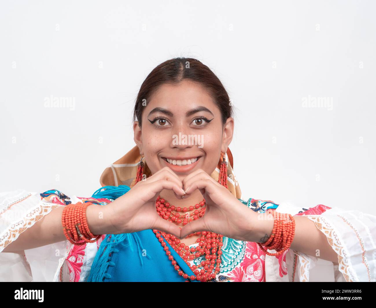 ecuadorian latin girl smiling and making the sign of heart with her ...