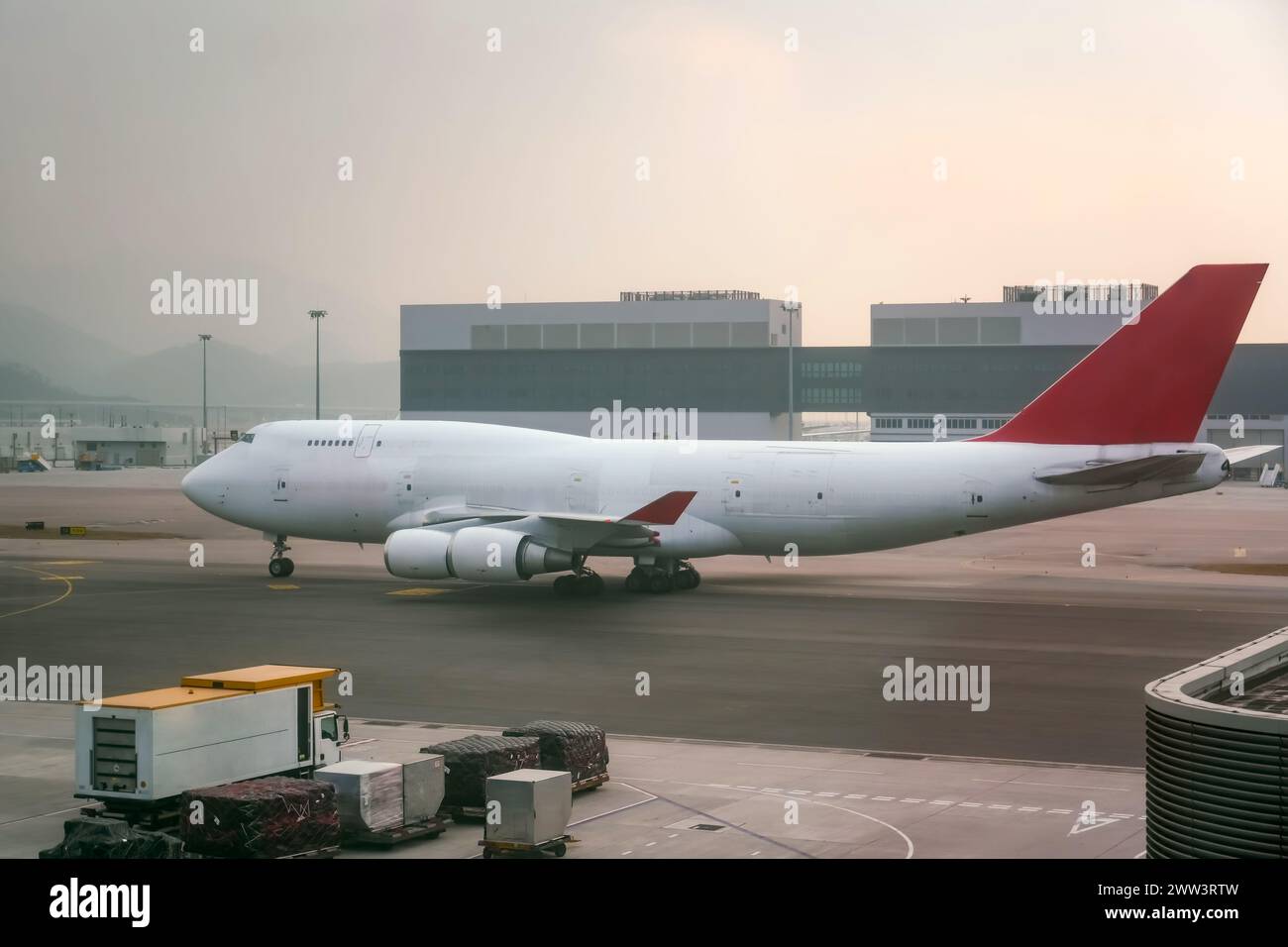 Cargo plane double decker fuselage without windows taxiing along the ...