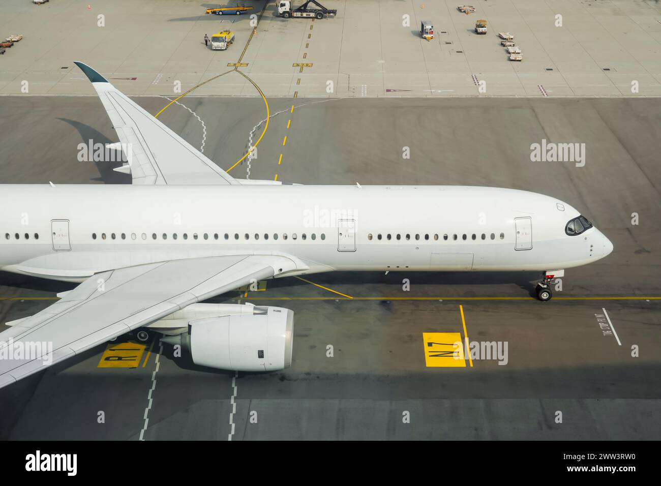 Aerial view of the airport road markings signs on the surface. Airplane ...