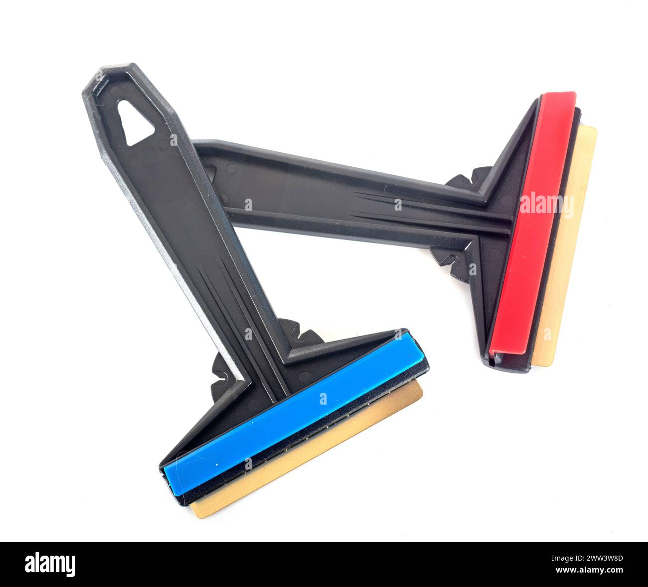 plastic ice scrapers in front of white background Stock Photo - Alamy