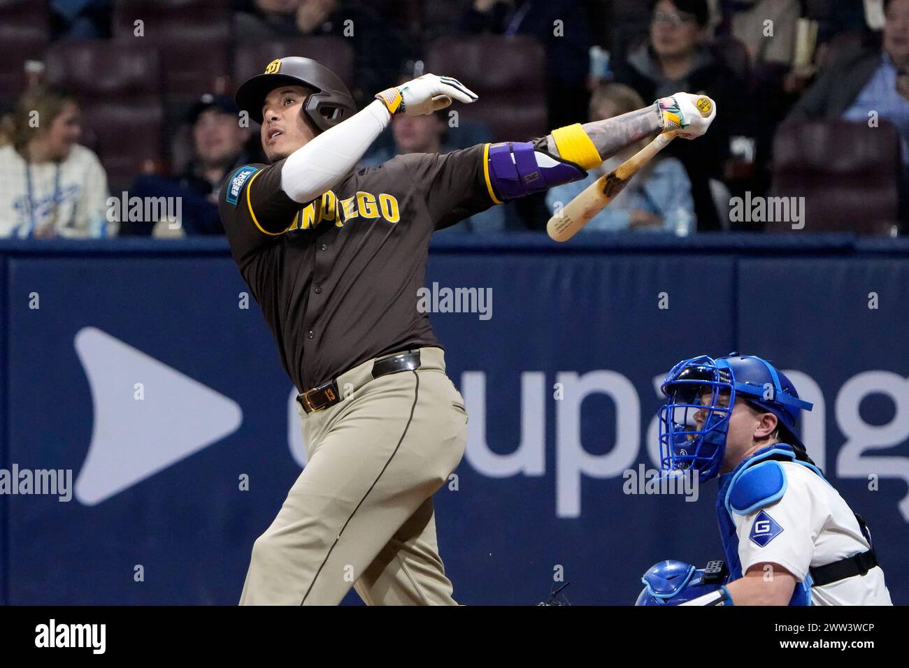 San Diego Padres' Manny Machado, left, hits a three-run home run as Los ...