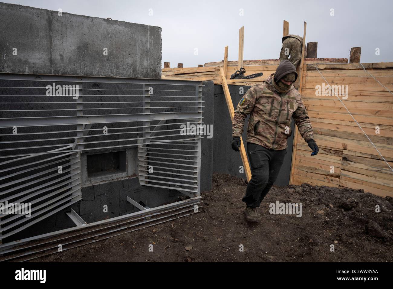 Ukrainian workers build the fortification line of defence in the ...