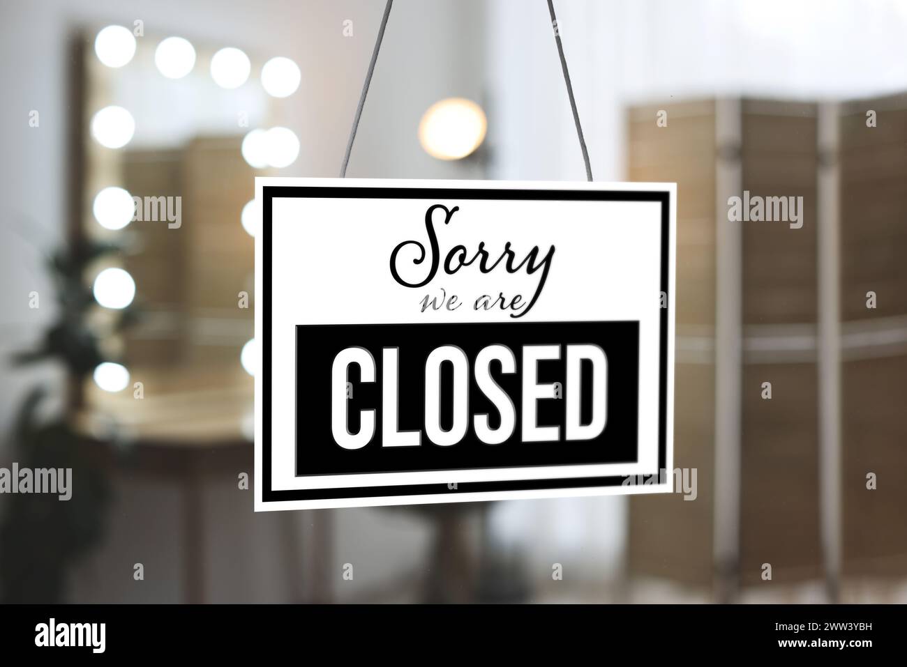 Sorry we are closed sign against blurred background Stock Photo - Alamy