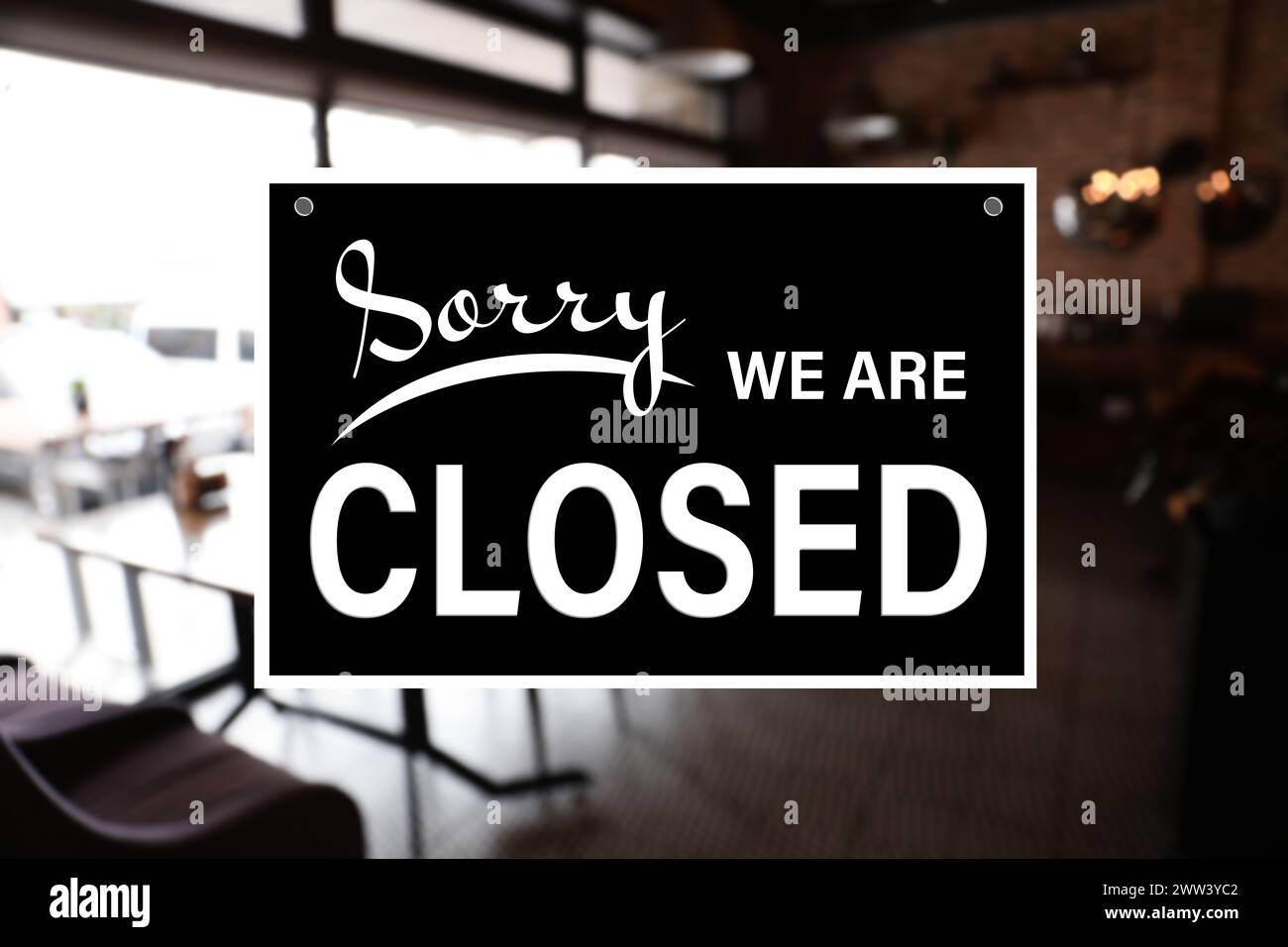 Sorry we are closed sign against blurred background Stock Photo - Alamy