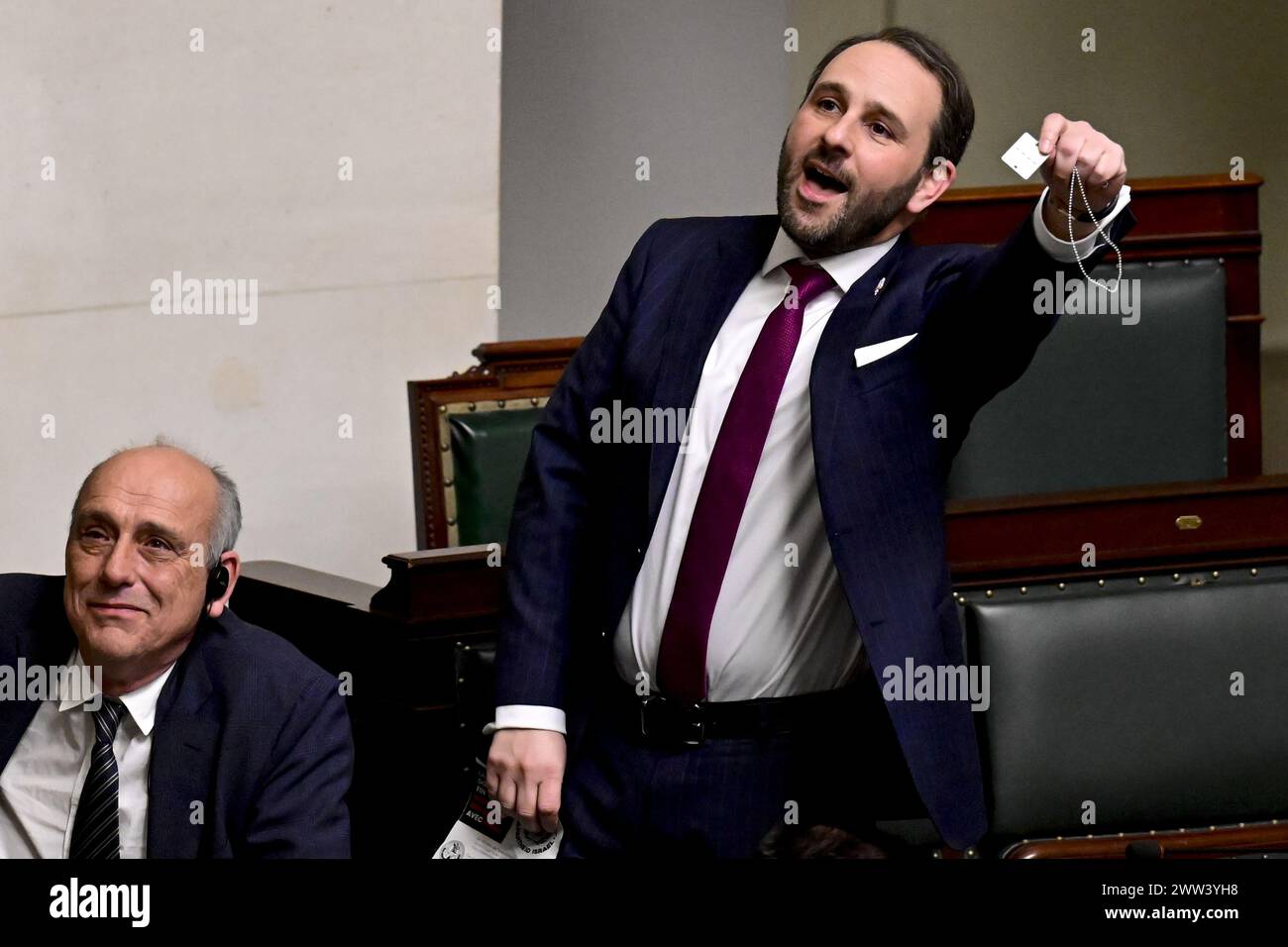 Brussels, Belgium. 21st Mar, 2024. N-VA's Michael Freilich shows a ...