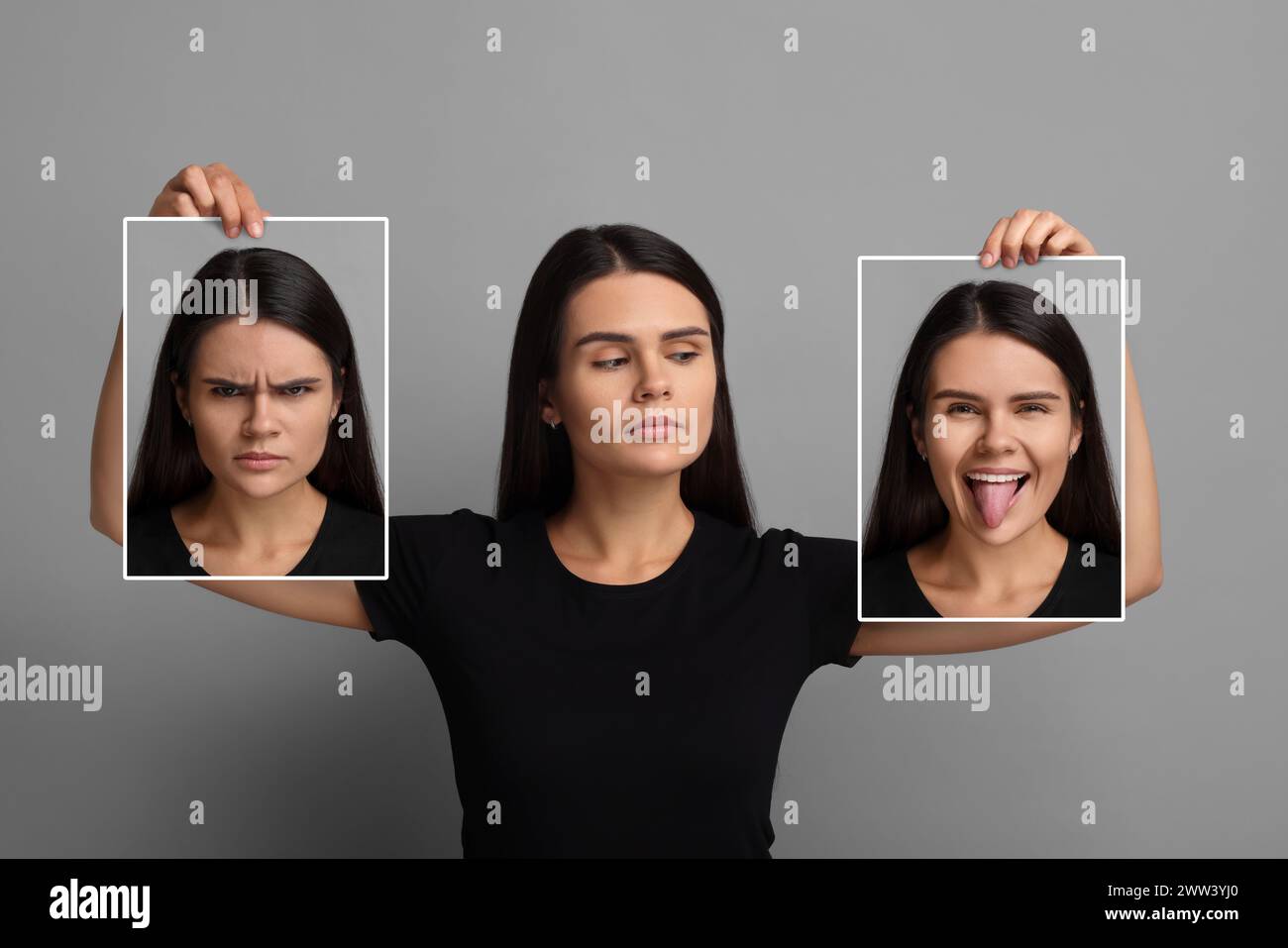 Woman holding her photo portraits showing different emotions on grey ...