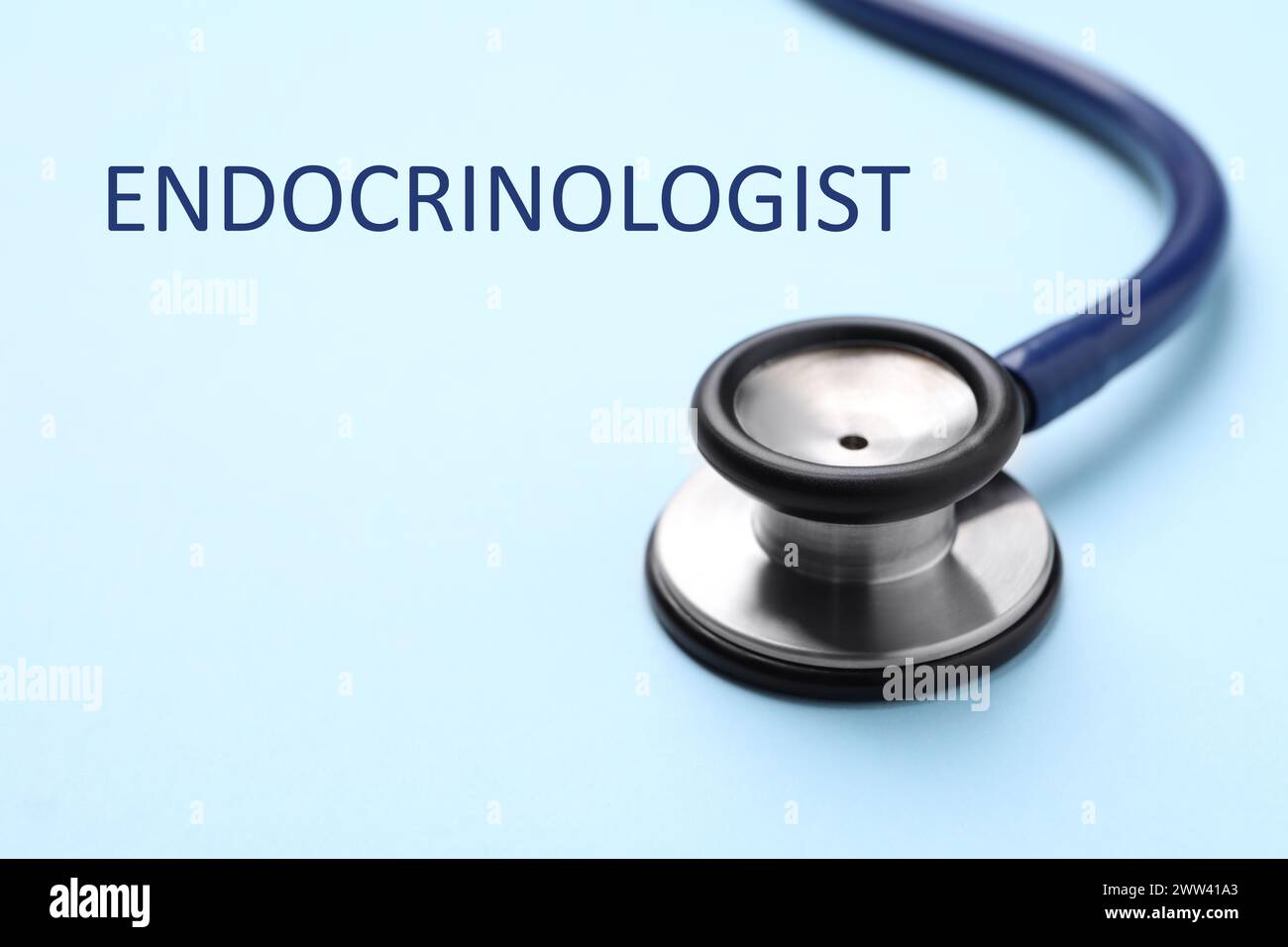 Endocrinologist. Stethoscope on light blue background, closeup. Space ...