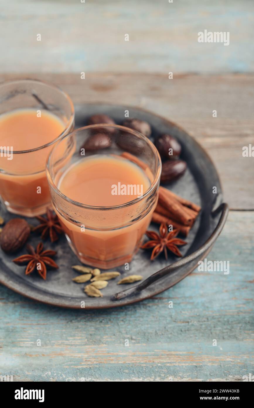 Traditional indian drink - masala tea with spices on metal tray on ...