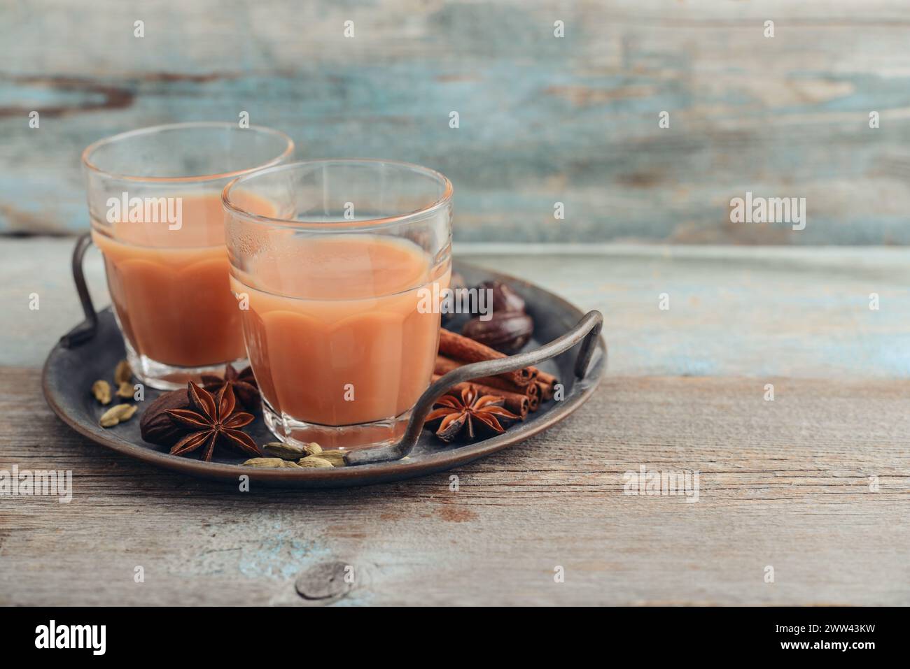 Traditional indian drink - masala tea with spices on metal tray on ...