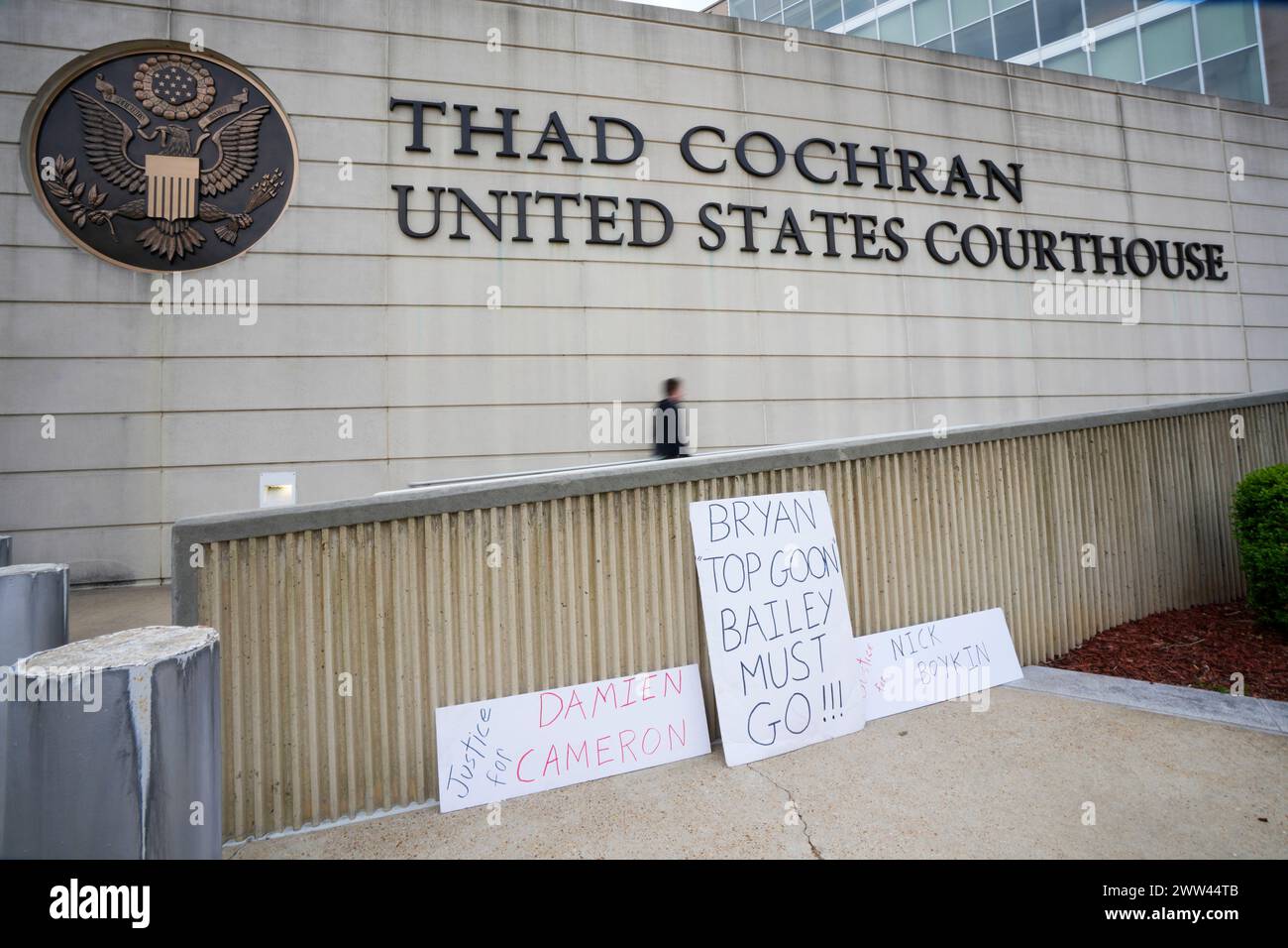 A few protest signs line the handicapped walkway at the Thad Cochran ...