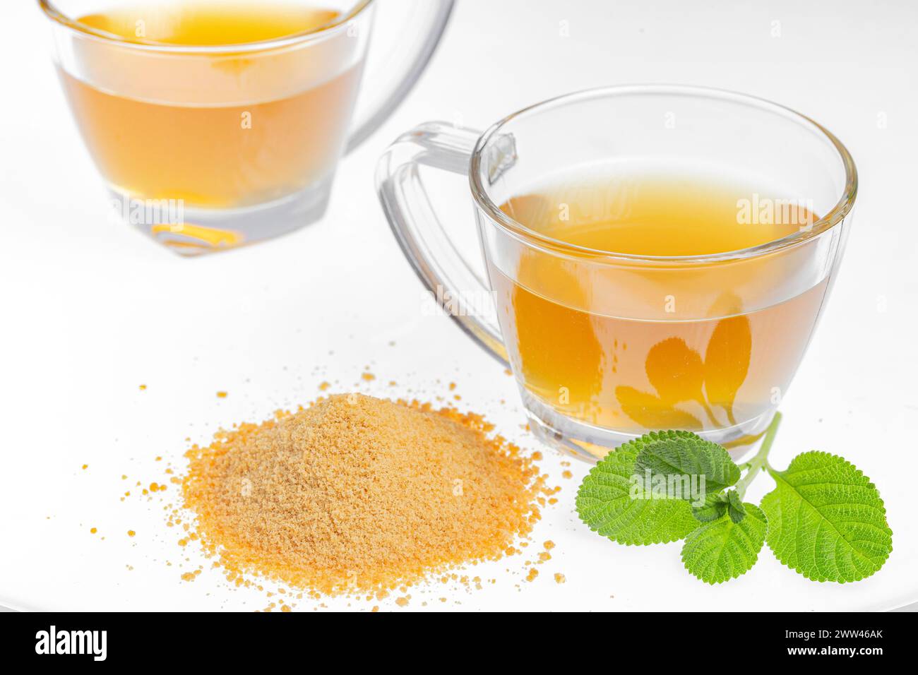 Drink of piloncillo and ground piloncillo, on white background ...