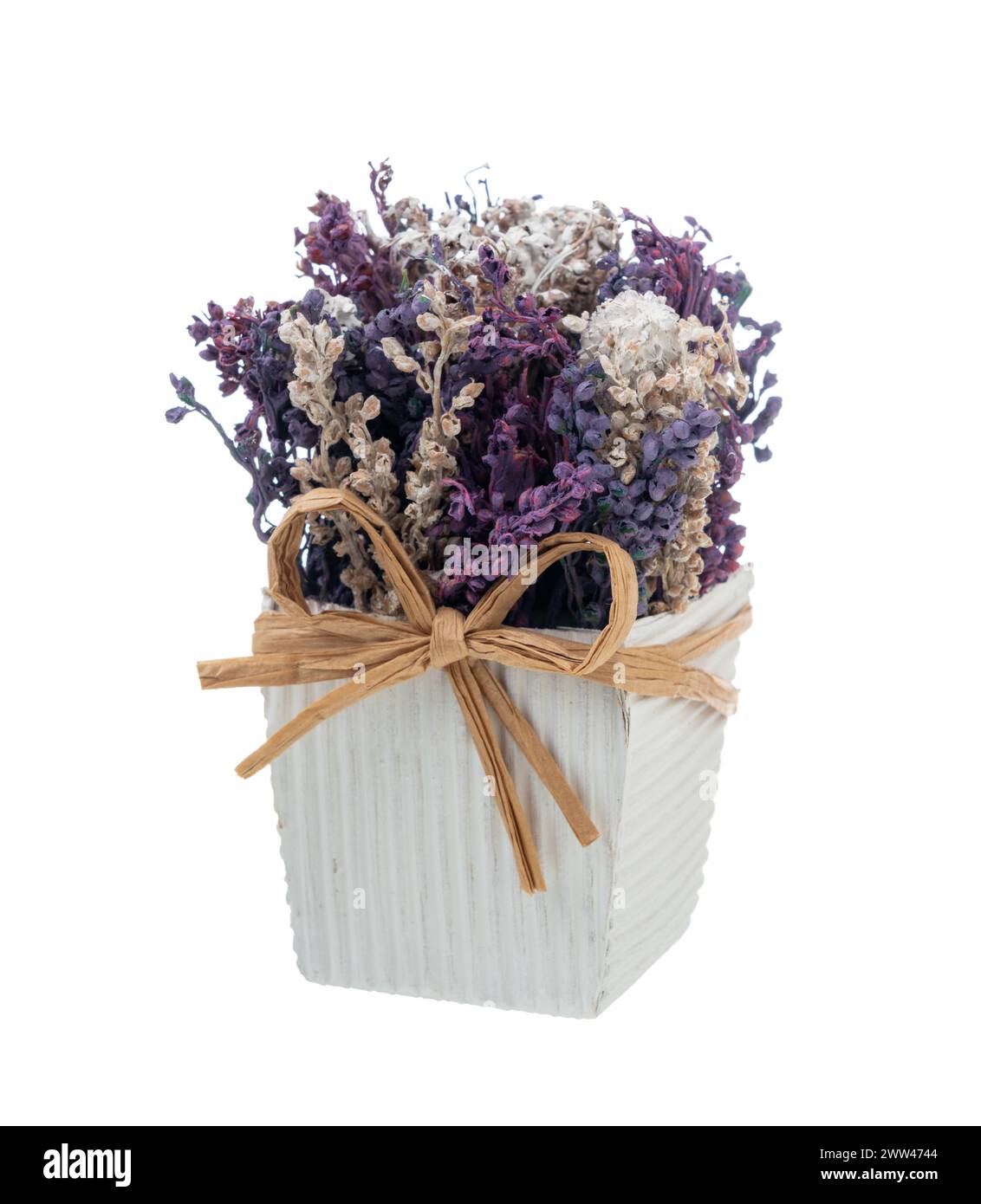 Artificial flowers in a vase of lavender and lavender flowers isolated ...