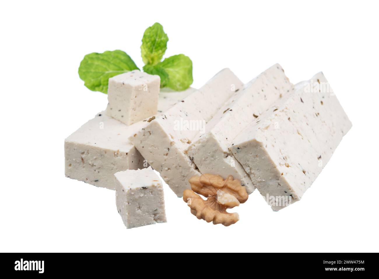 A pile of diced sea tofu cheese isolated on a white background vegan ...