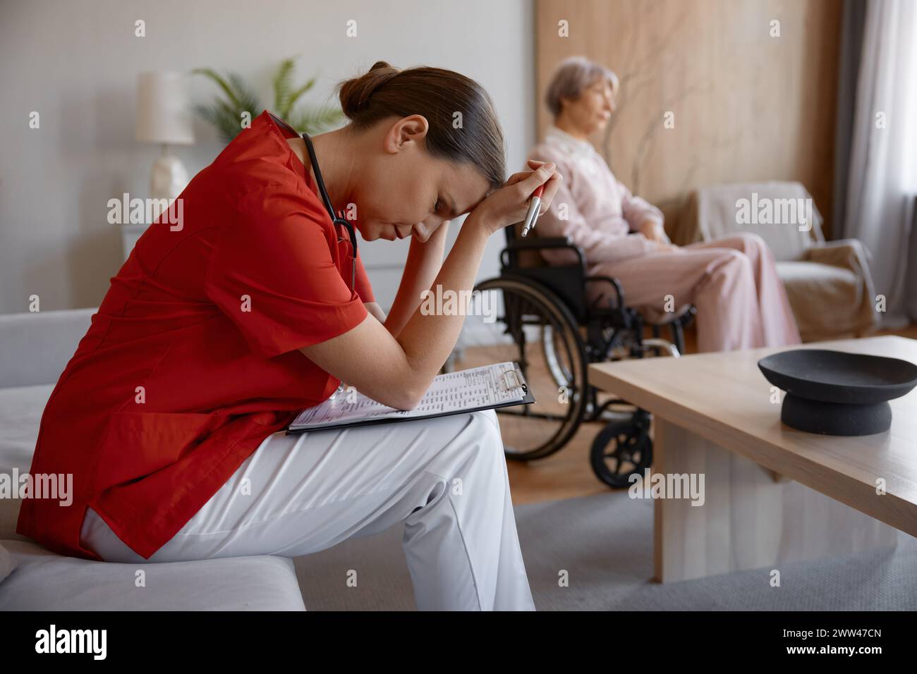 Upset frustrated doctor holding head leaned over patient card Stock ...