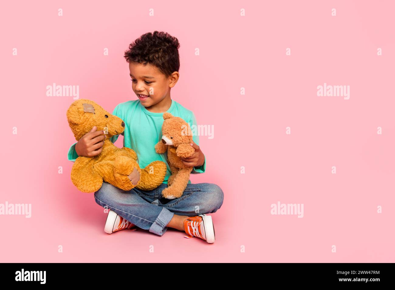 Full size photo of charming small boy sit floor play toys two teddy ...