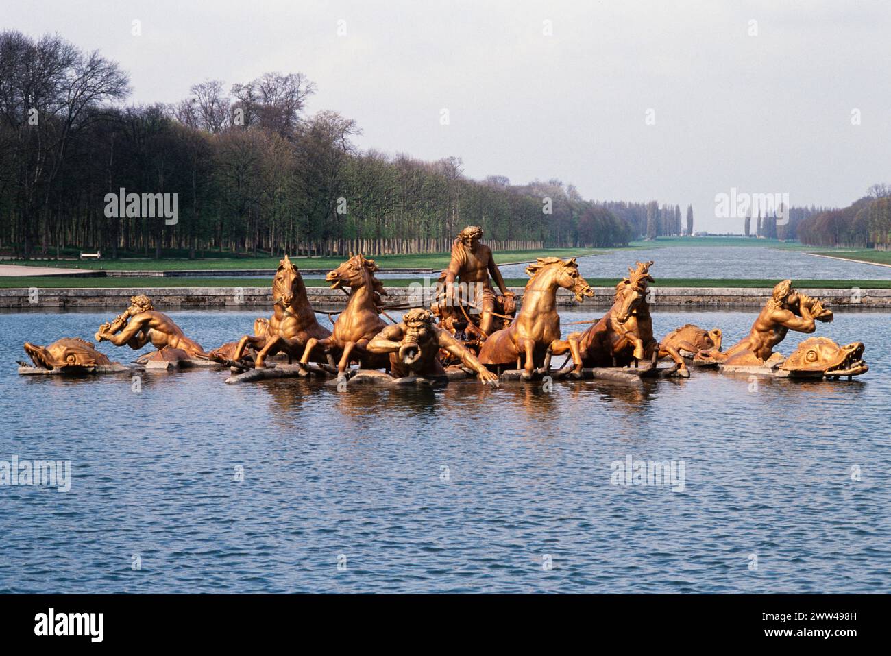 Apollo Fountain in the gardens of the Palace of Versailles. We observe ...
