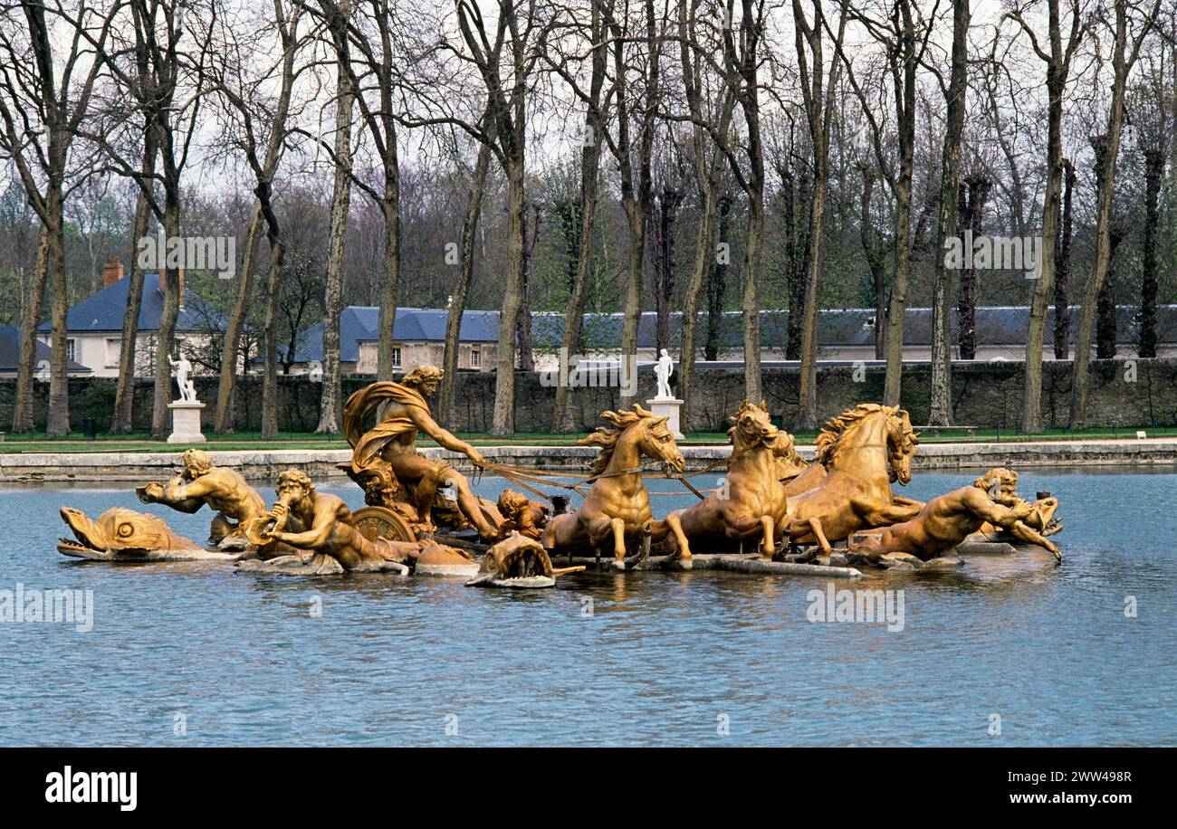 Apollo Fountain in the gardens of the Palace of Versailles. We observe ...