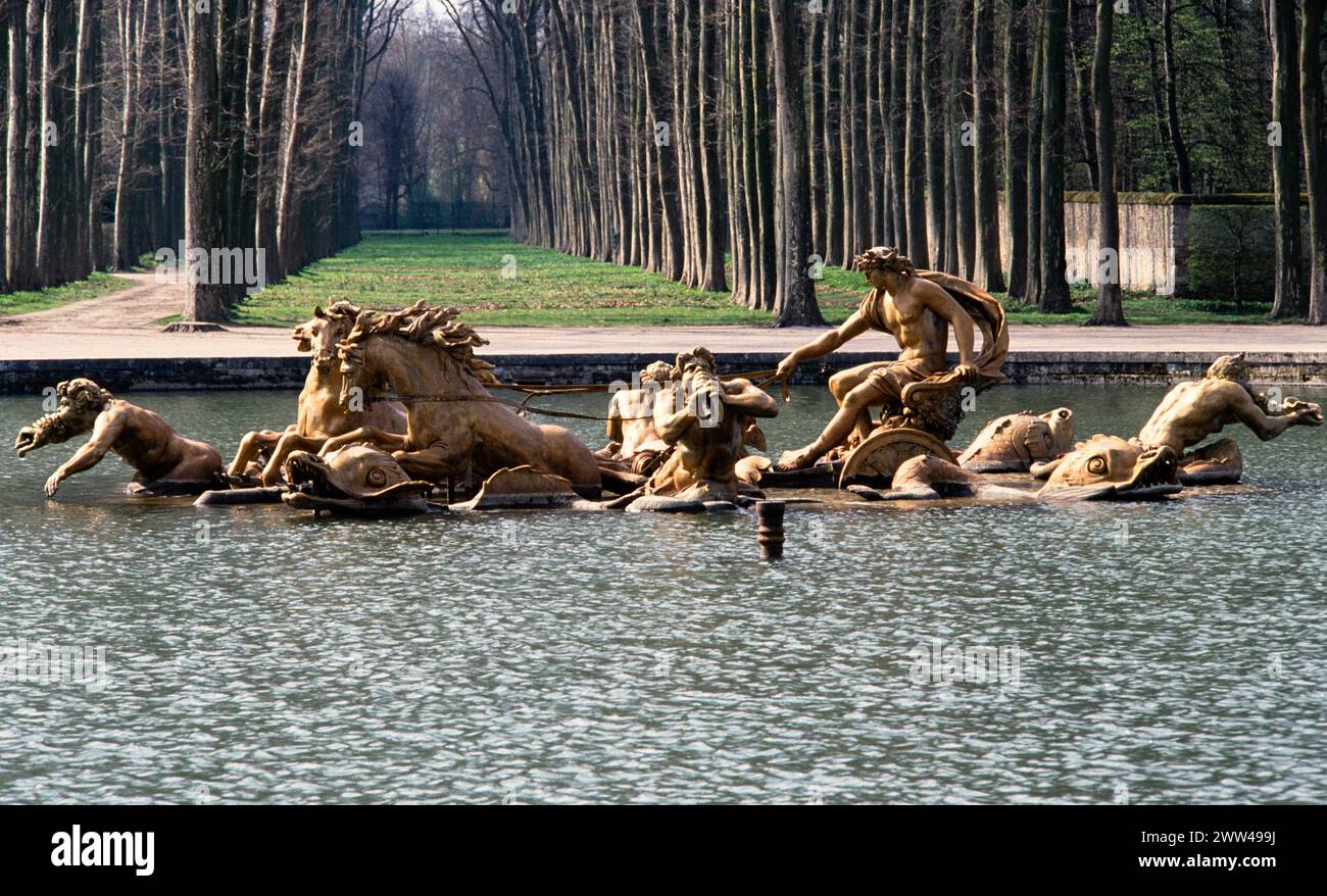 Apollo Fountain in the gardens of the Palace of Versailles. We observe ...