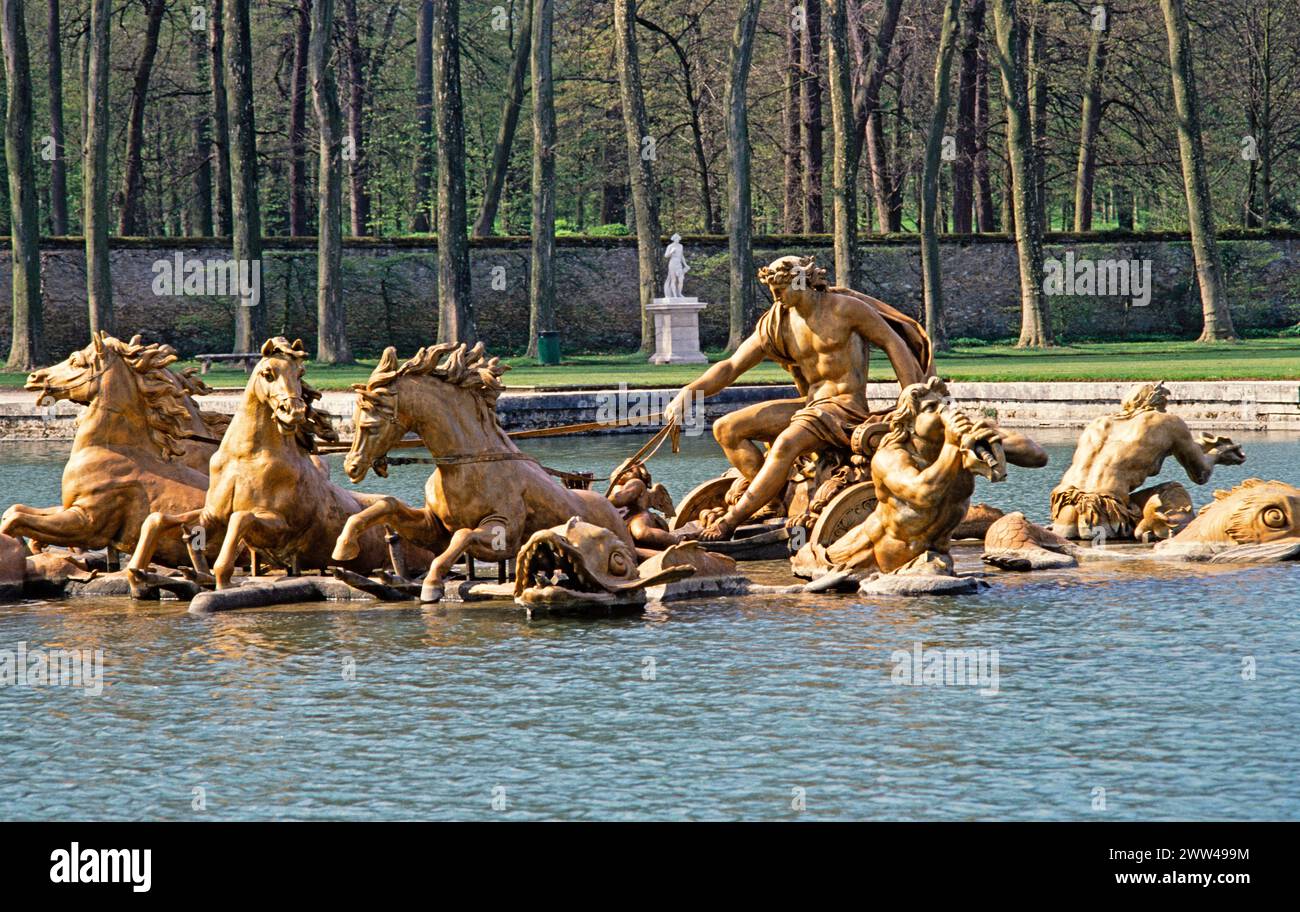Apollo Fountain in the gardens of the Palace of Versailles. We observe ...