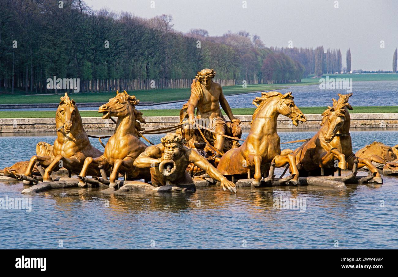Apollo Fountain in the gardens of the Palace of Versailles. We observe ...