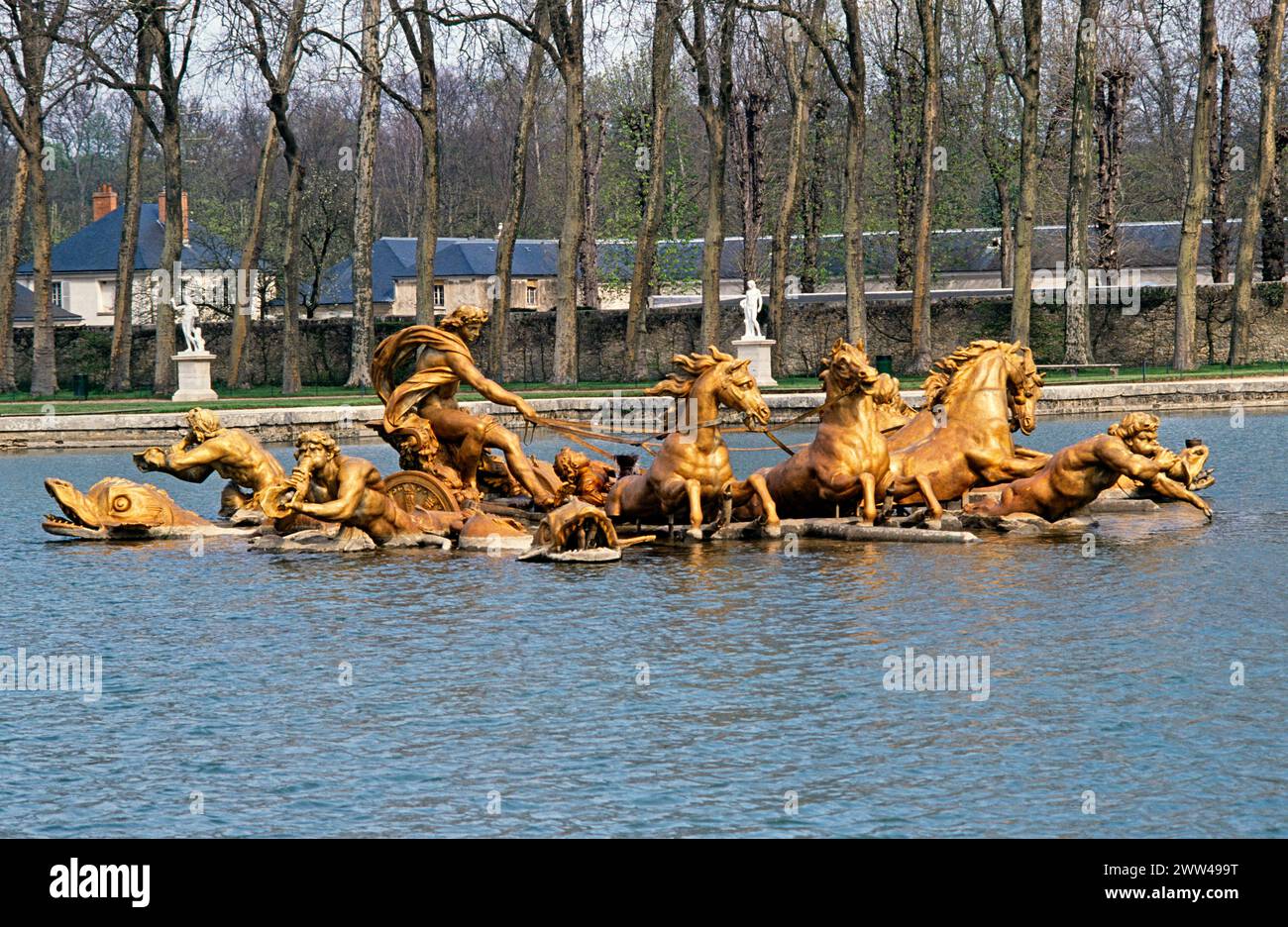 Apollo Fountain in the gardens of the Palace of Versailles. We observe ...