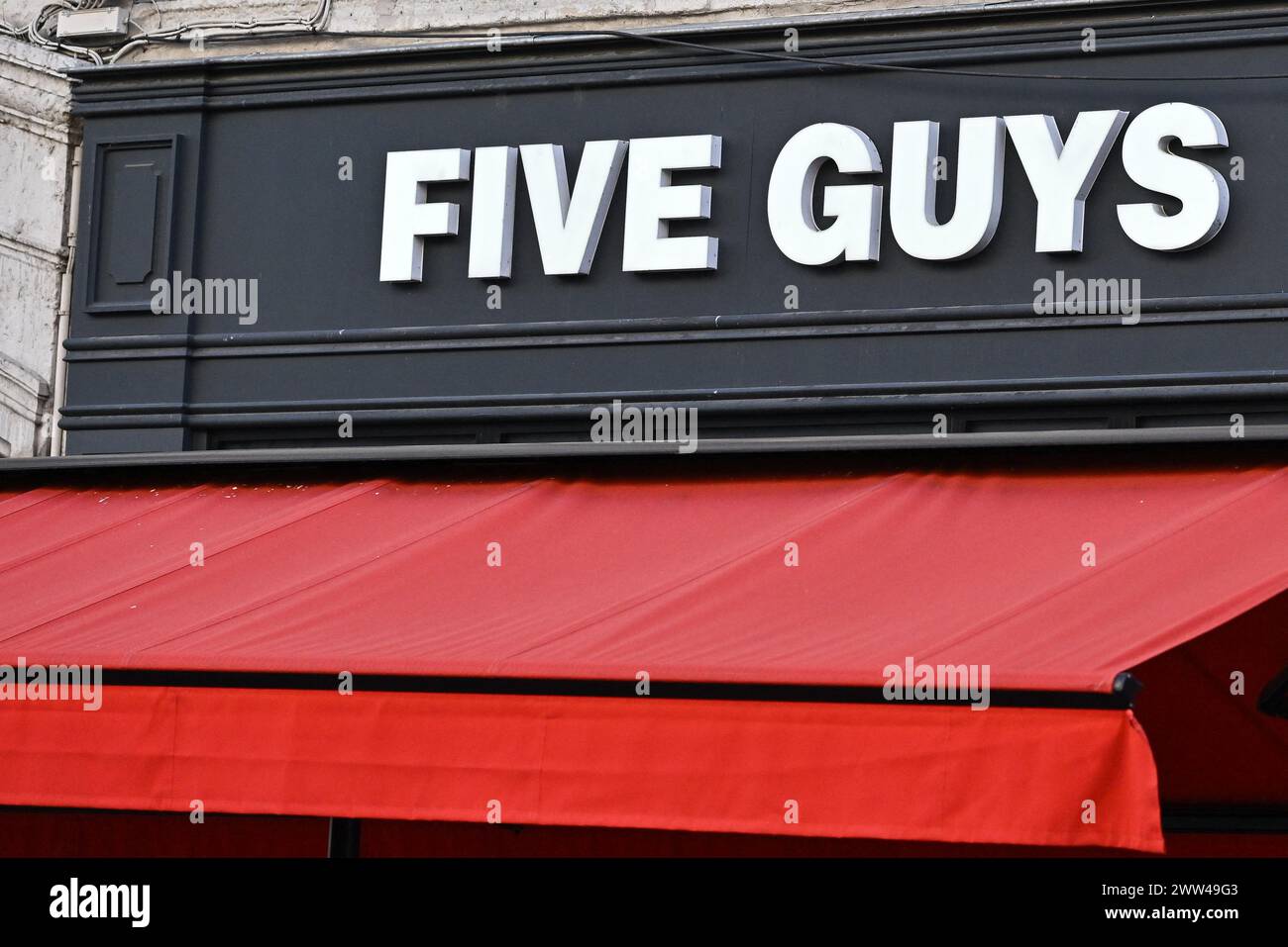 Five Guys Illustration of commercial signs and shops in Lyon, France on ...