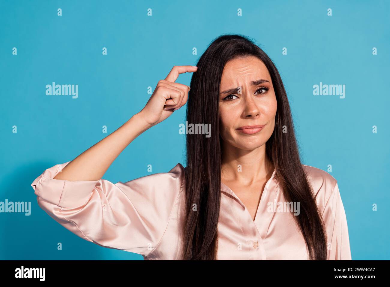 Photo of suspicious unsure cute woman with straight hairdo dressed silk ...