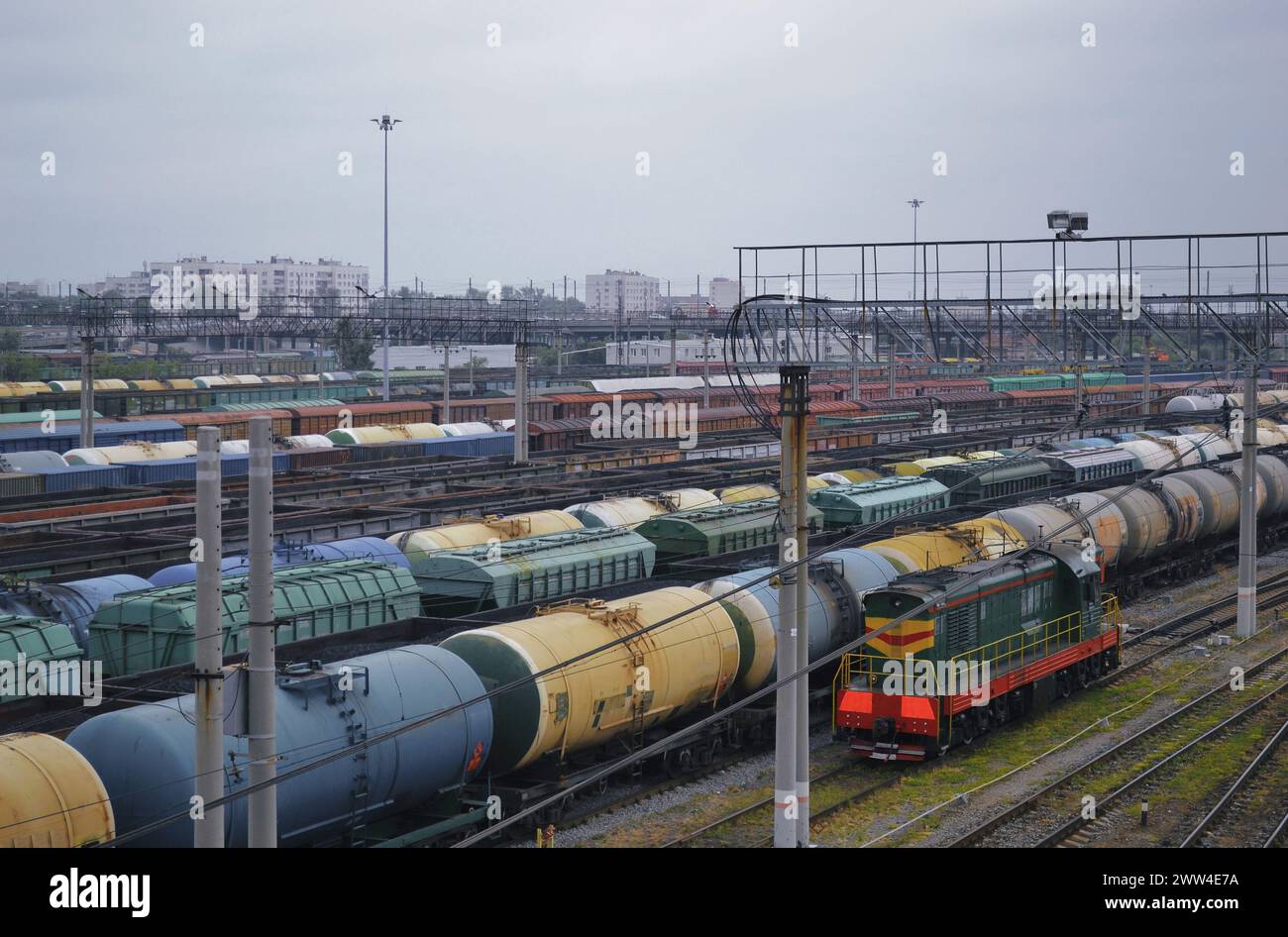 Train and freight cars are parked on the railroad tracks Stock Photo ...