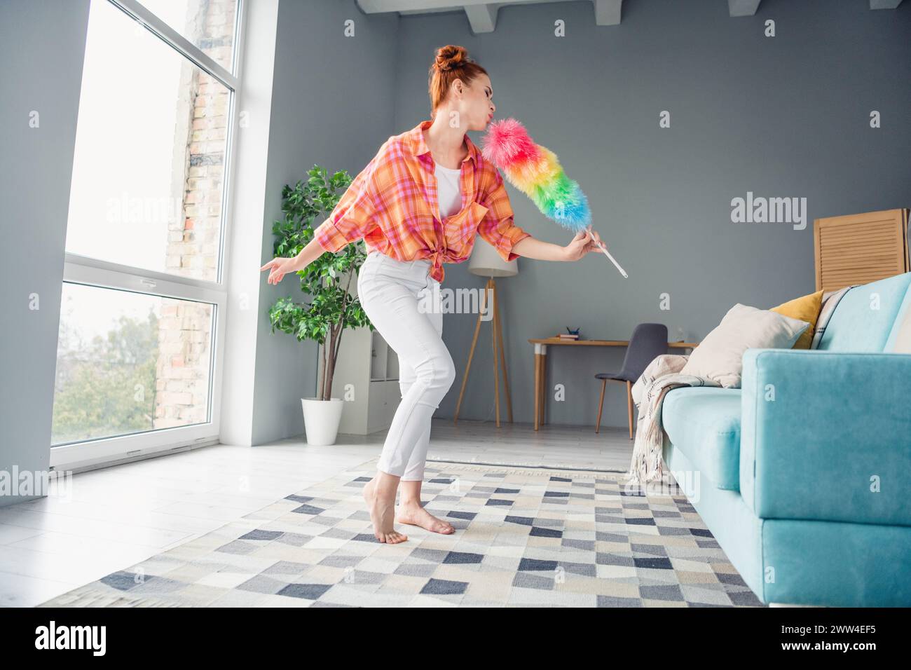 Full length portrait of charming carefree female person hold duster ...
