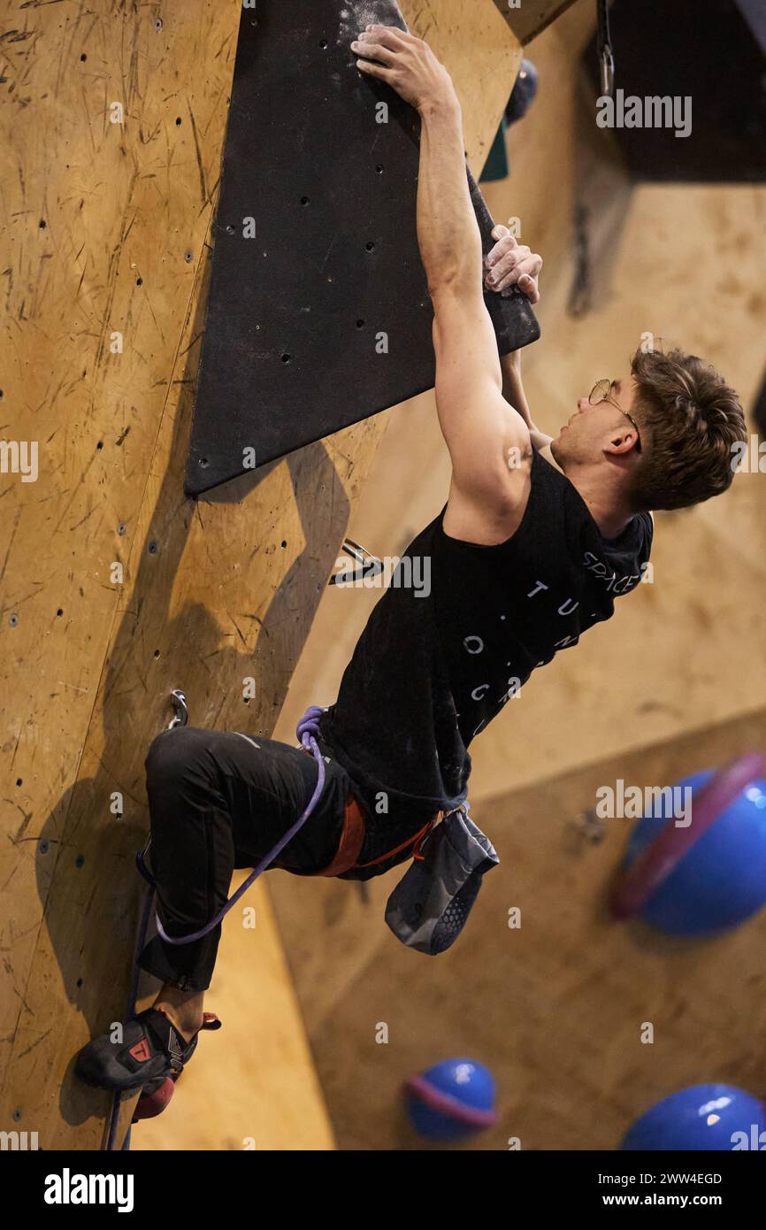 Professional climber athlete starts the climb in the final of the All ...