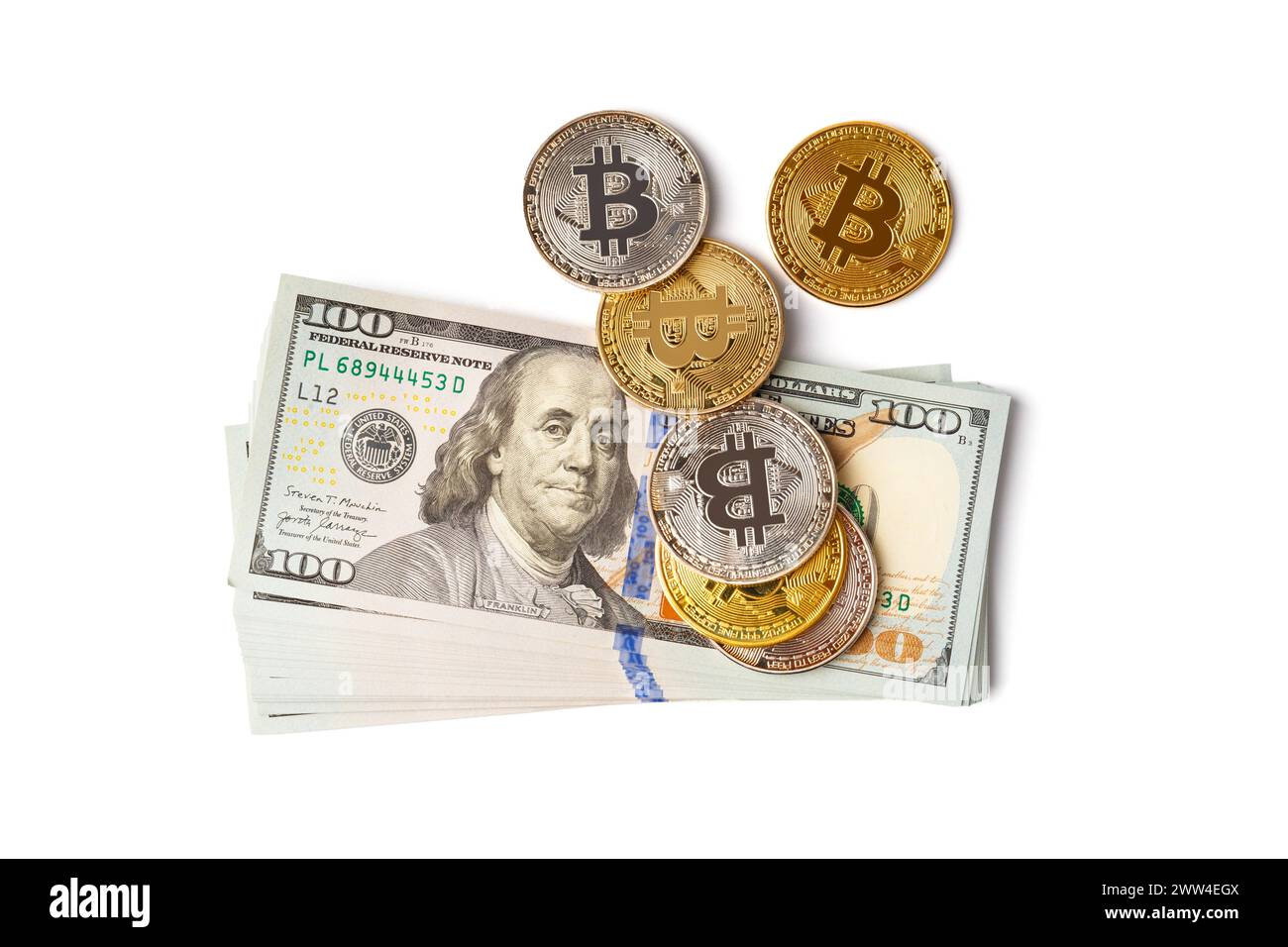 Bitcoins, banknotes of 100 dollars on a white background top view, the ...