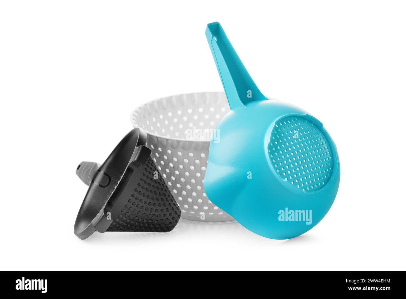 Set of plastic sieves of different shapes, sizes and colors, isolated ...