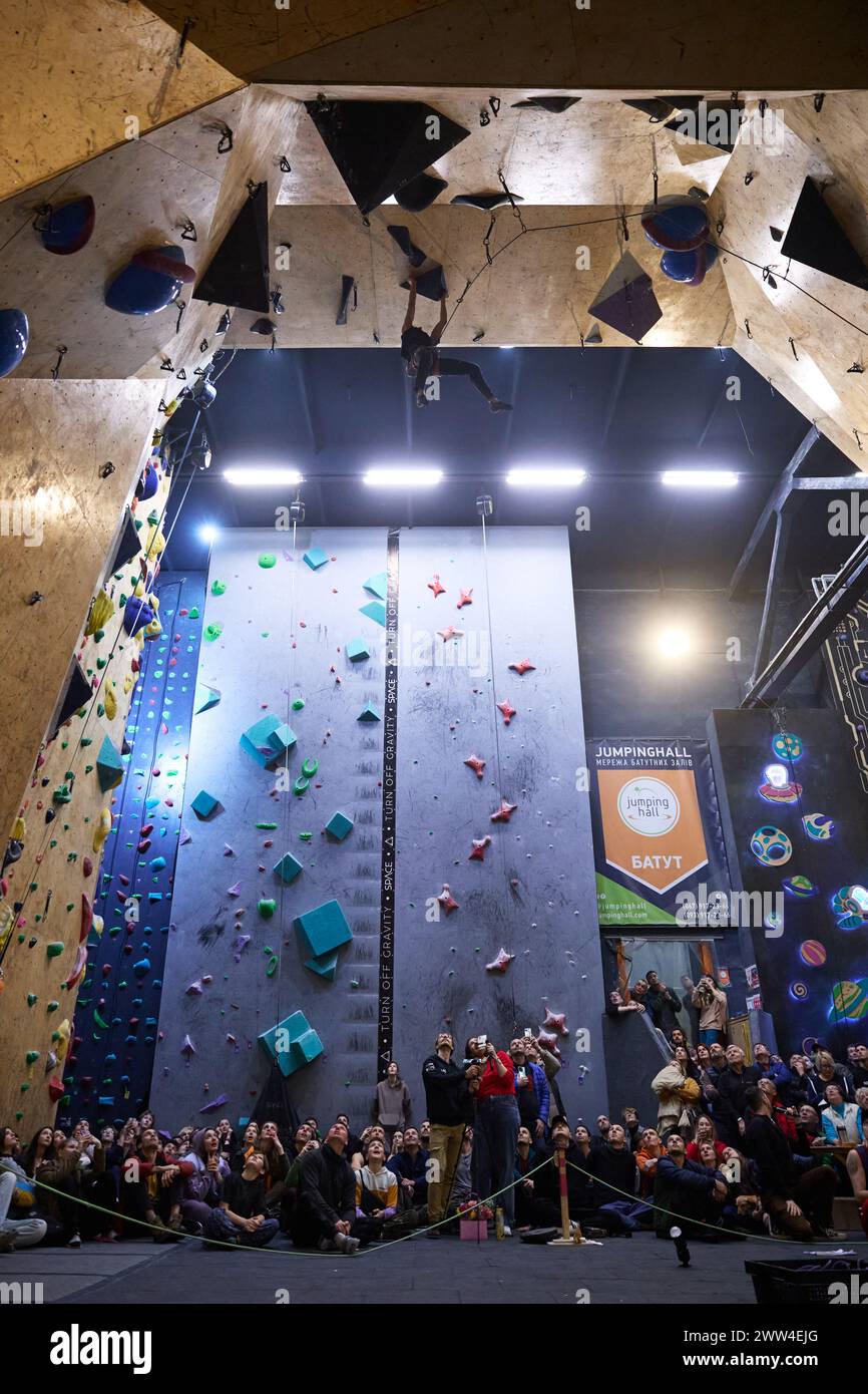 Climber hanging on a high wall at the finals of All-Ukrainian Climbing ...
