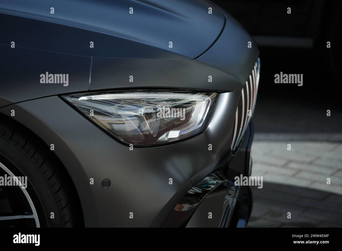 Headlights and front wheel of a modern car close-up, elegant auto ...