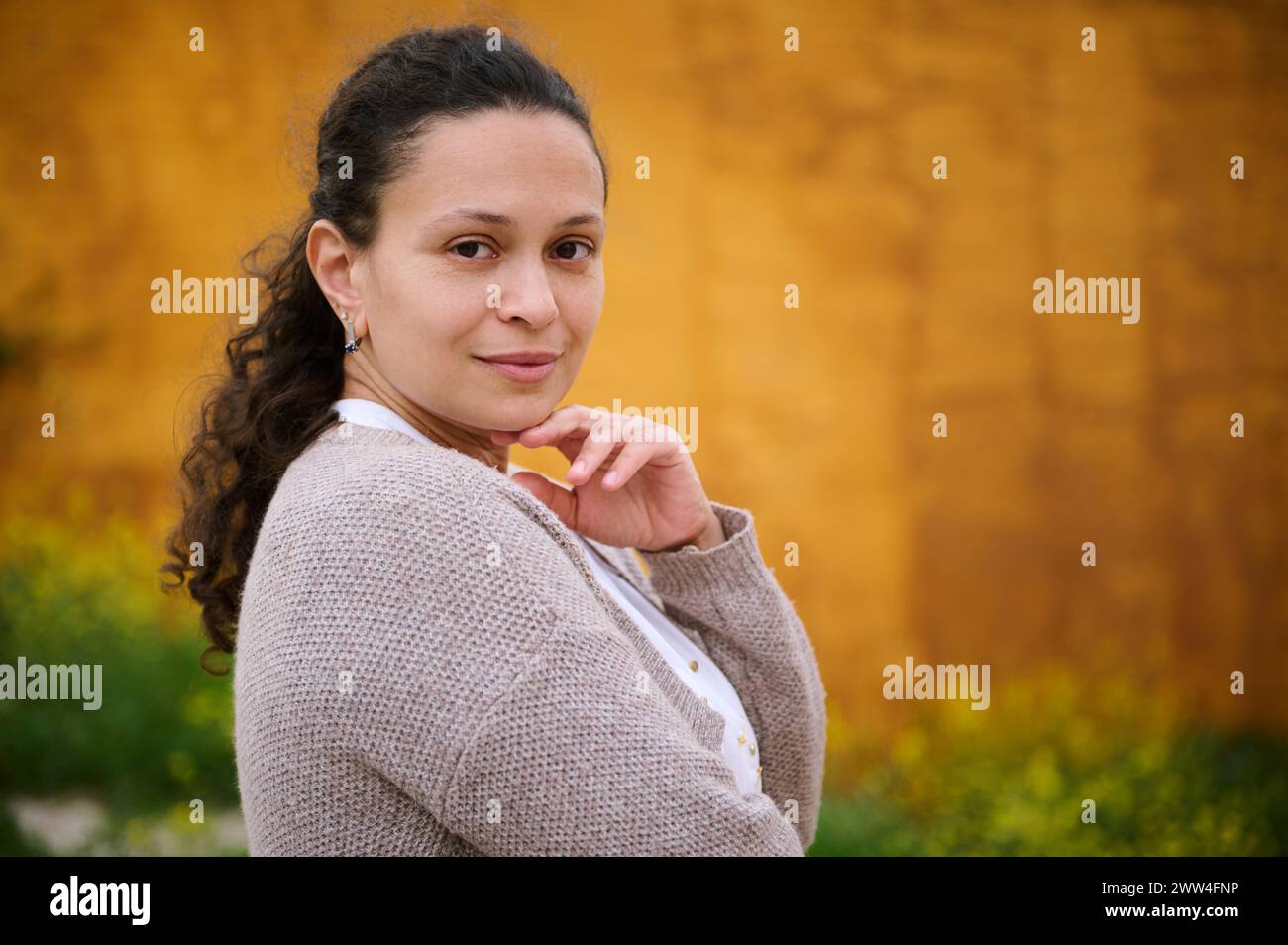 Portrait confident middle aged multi ethnic pretty woman looking at ...