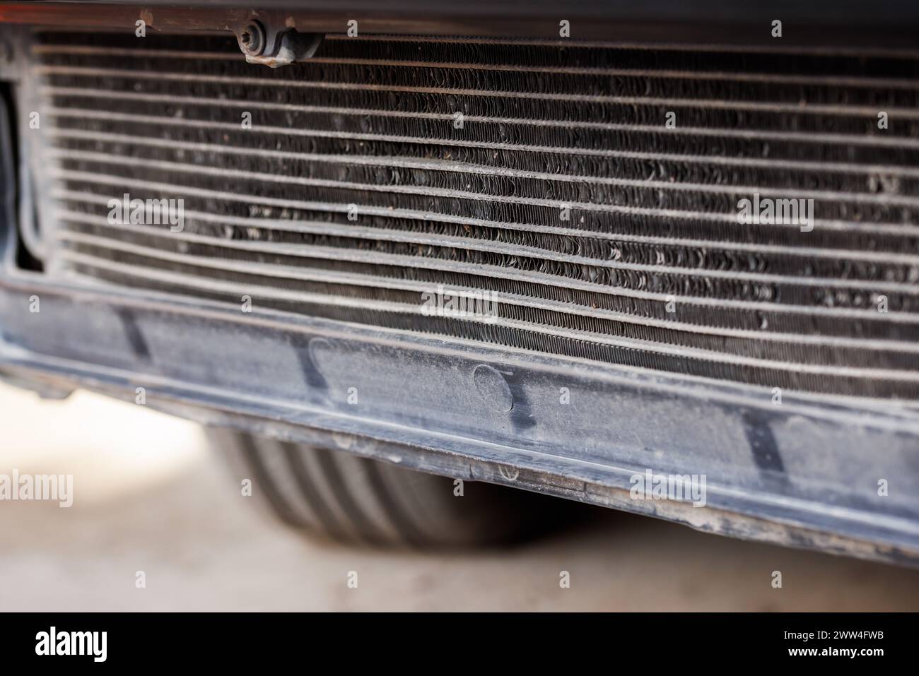 beaten but alive car AC radiator with rock hit traces Stock Photo - Alamy