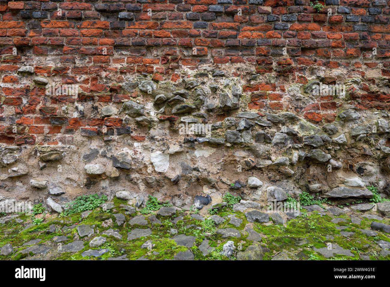 Detail of the ancient city wall of London, UK. A medieval wall with the ...