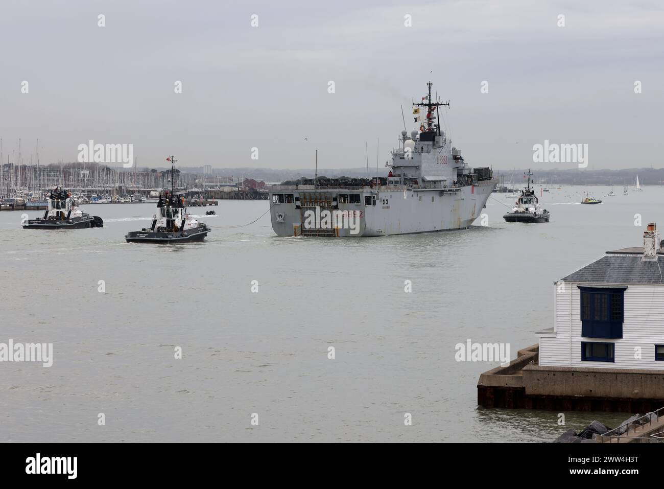 Tugs guide the Italian Navy amphibious transport dock ITS SAN GIORGIO ...