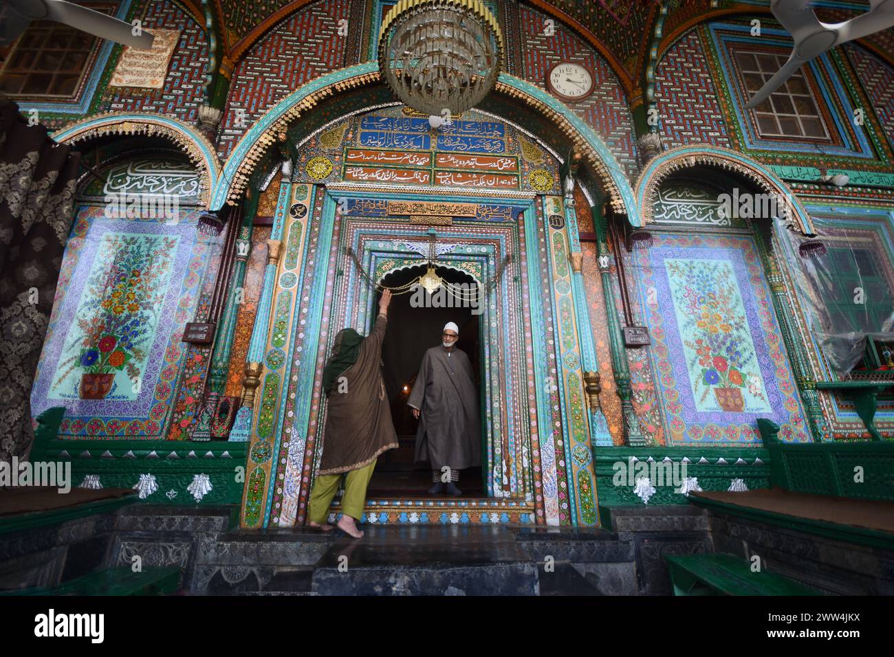 Srinagar, India. 15th Mar, 2024. Kashmiri Muslim touches the holy chain ...
