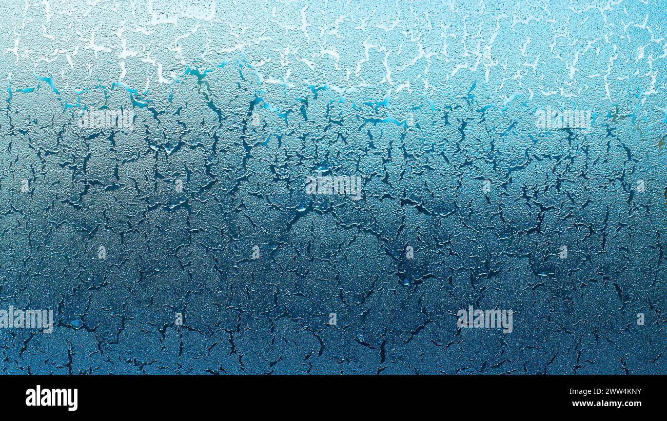 Blue shade texture resembling cracked earth formed on a frosty car ...