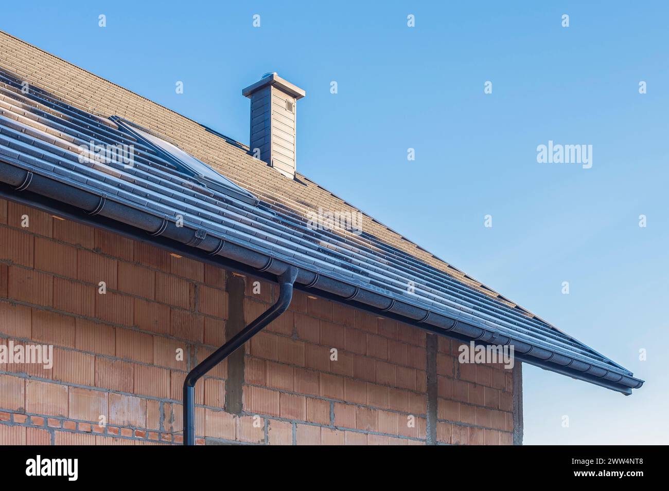 The frozen roof of the house under construction. Winter morning at the ...
