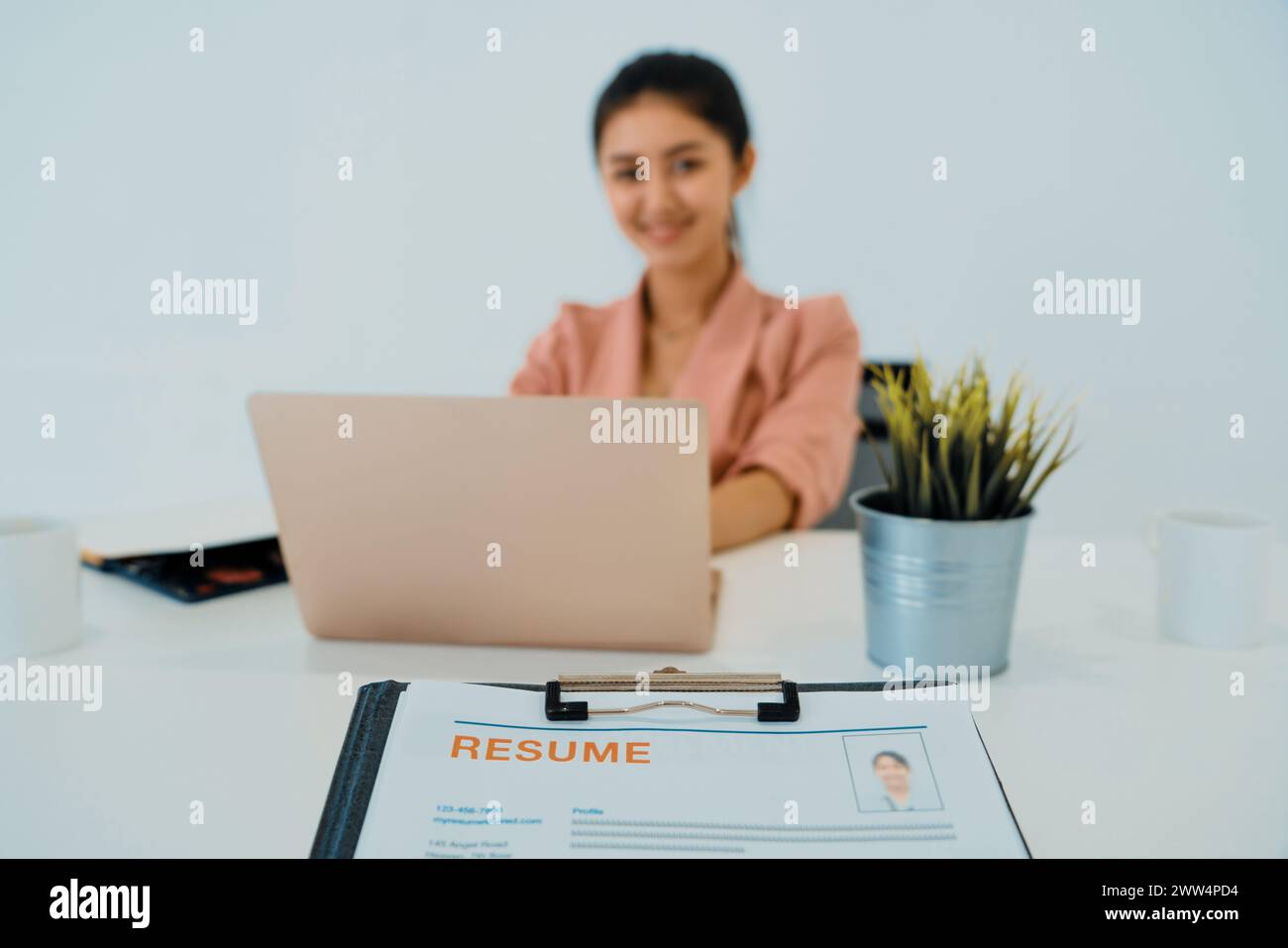Resume or CV (curriculum vitae) document paper sent to businesswoman ...