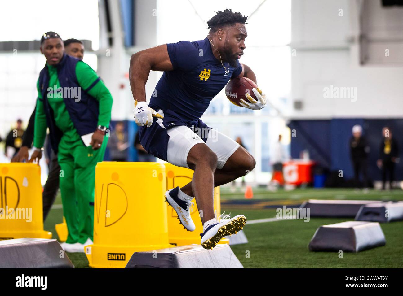 Notre Dame running back Audric Estime runs a drill during pro day ...