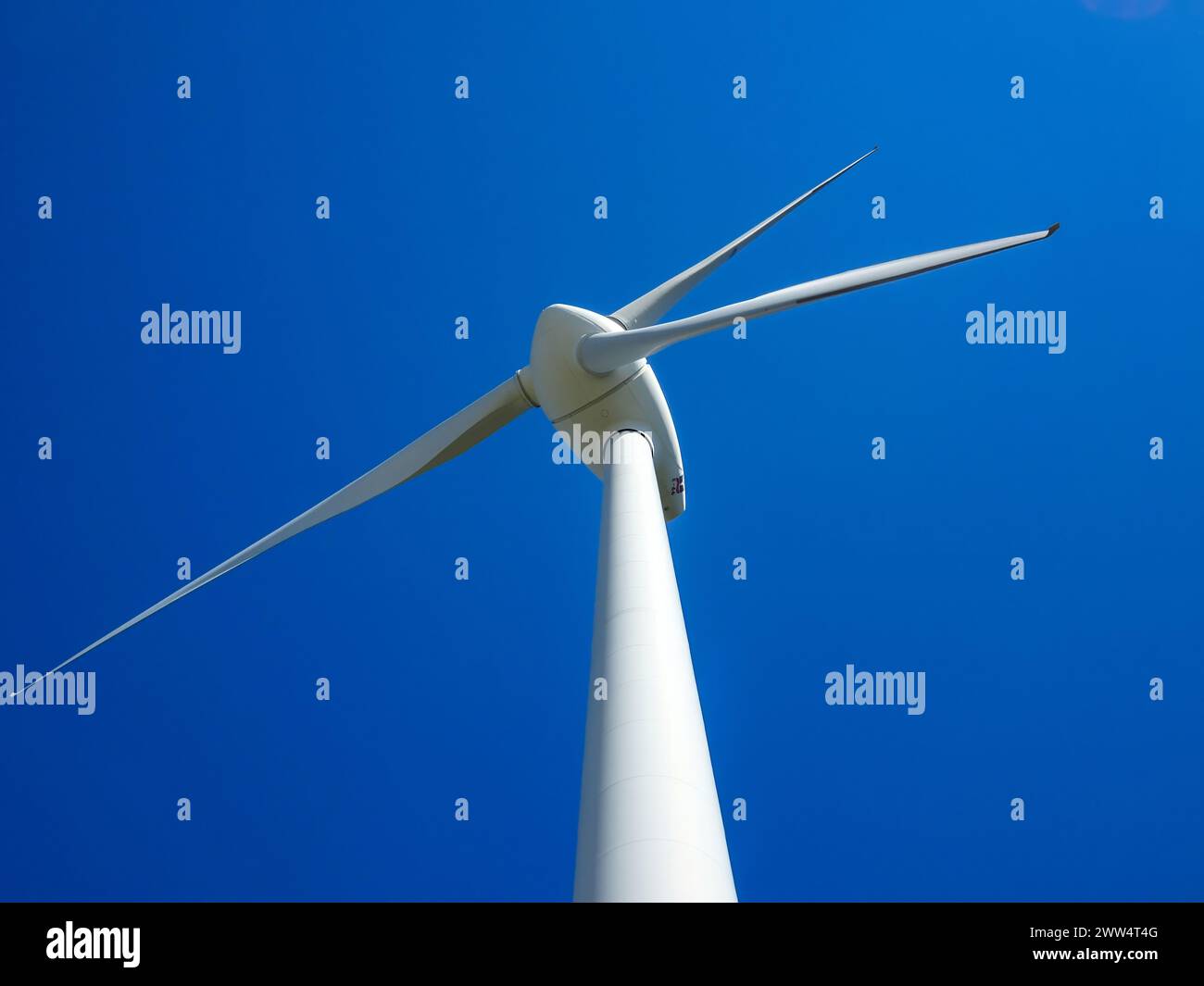 close-up portrait of wind turbine in blue sky Stock Photo - Alamy