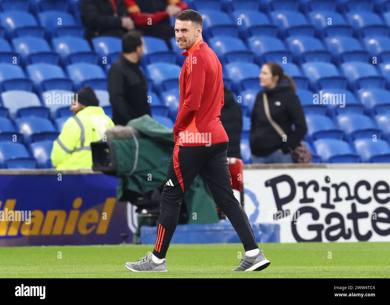 Cardiff, UK. 21st Mar, 2024. Aaron Ramsey of Wales takes a look at th ...
