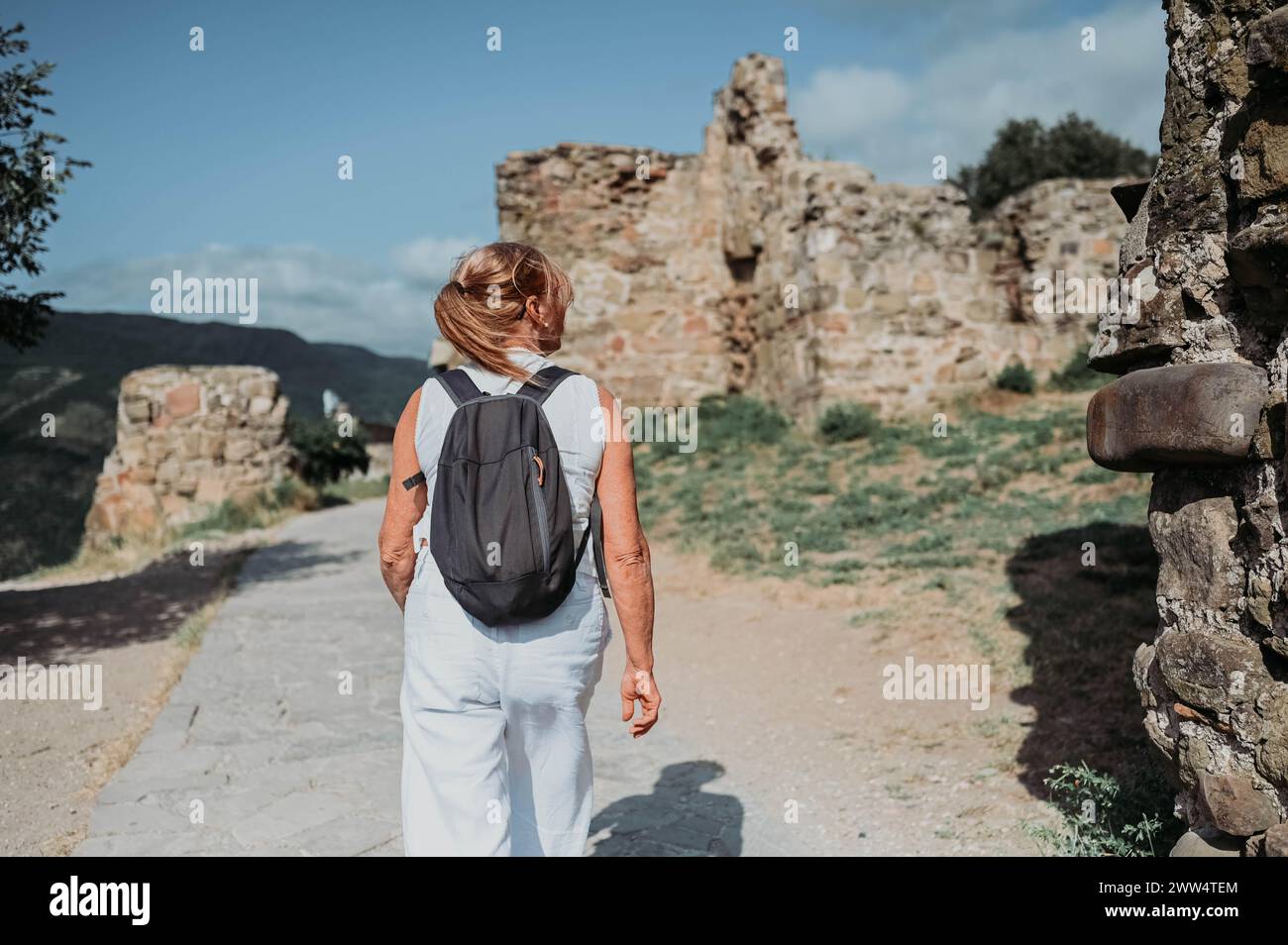 Elderly smiling senior traveling mature woman backpacker tourist ...