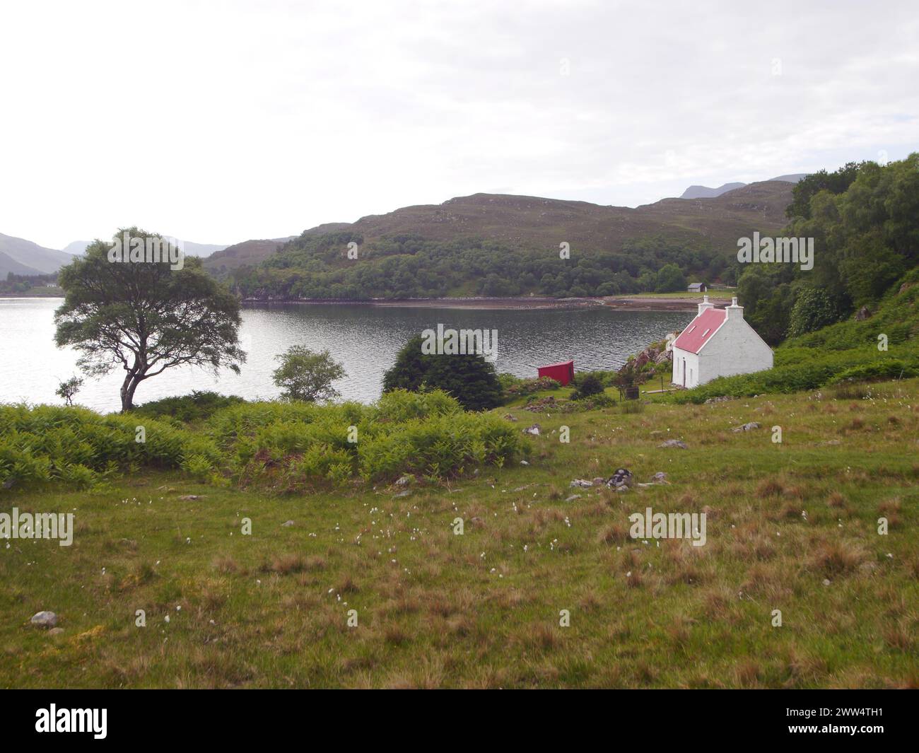 Red roofed house at loch torridon scotland Stock Photo - Alamy