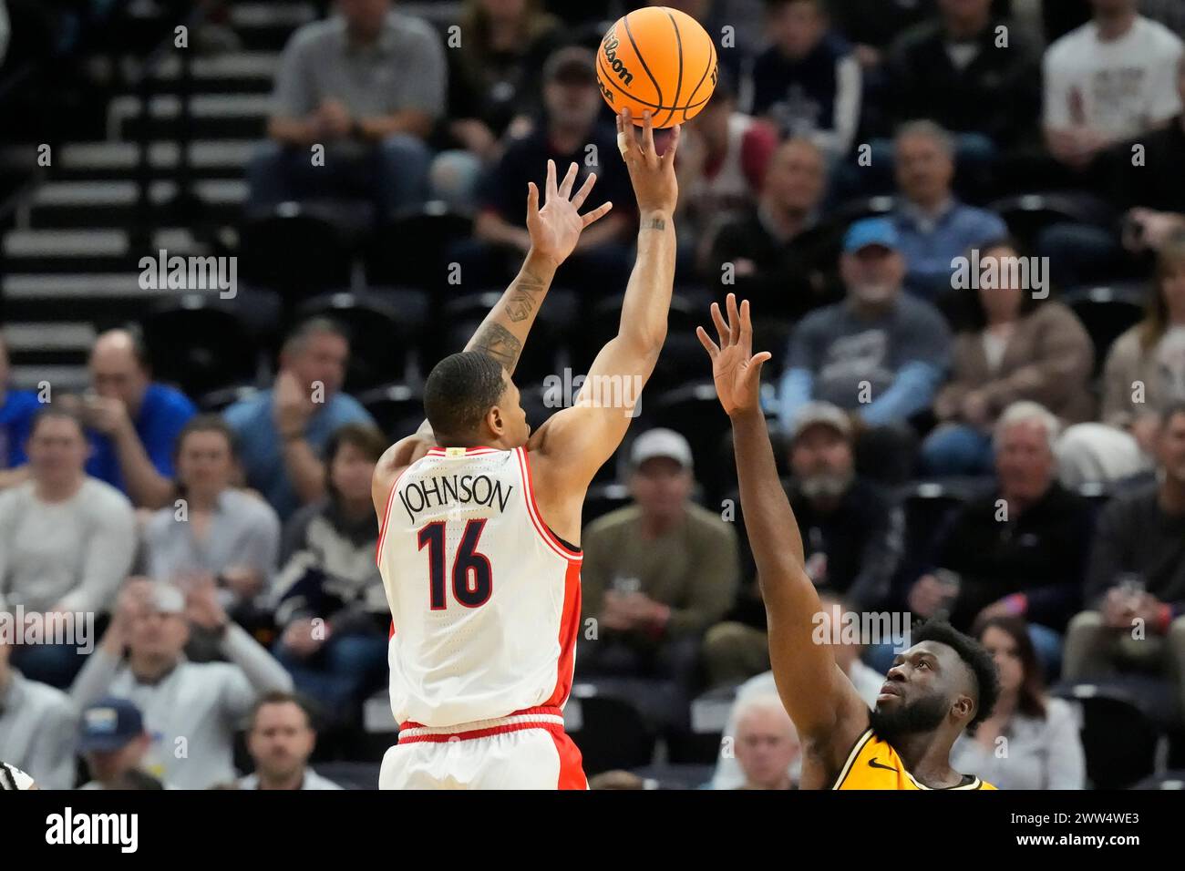Arizona forward Keshad Johnson (16) shoots as Long Beach State forward ...